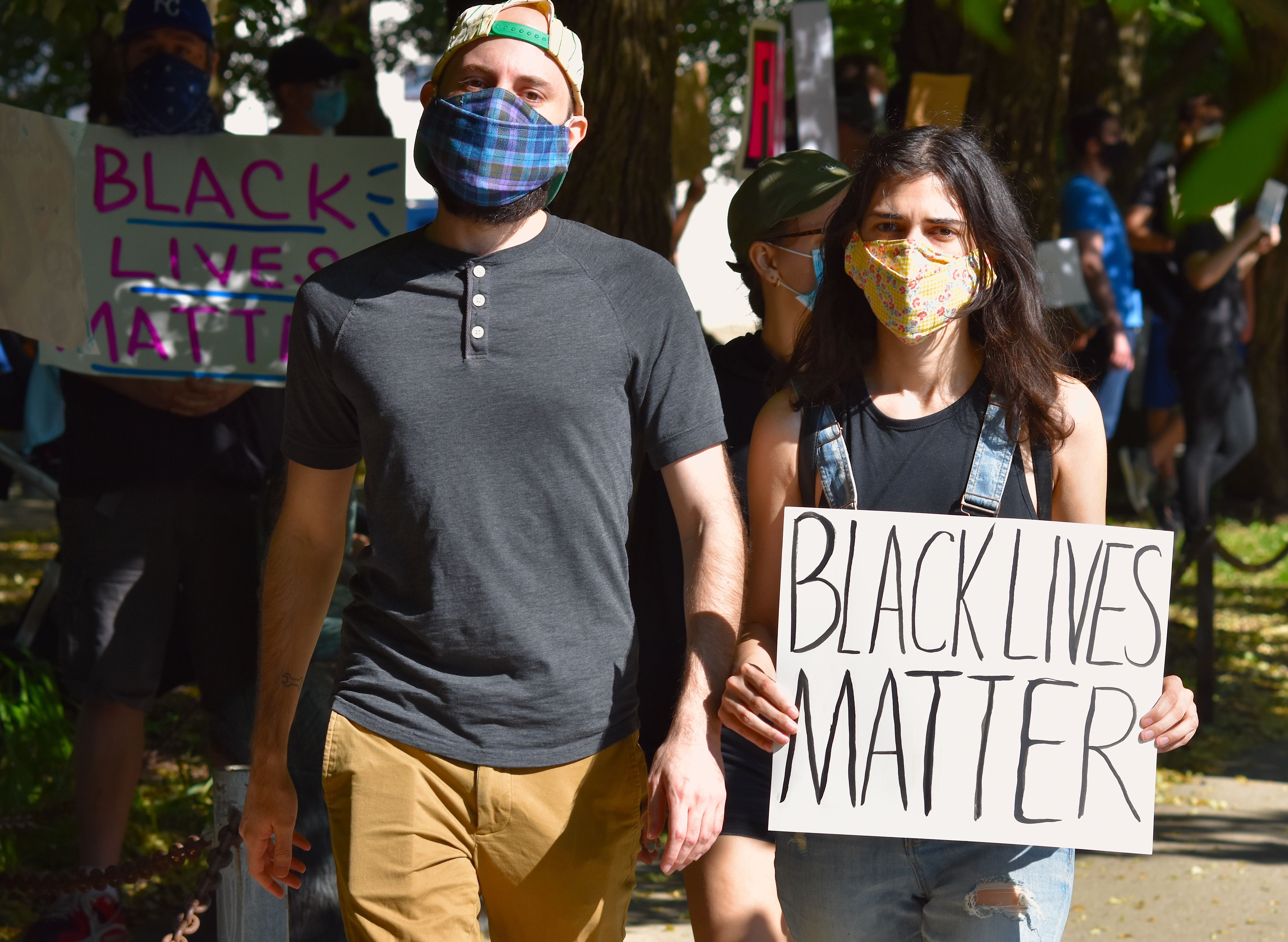 Masked Protesters Holding Black Lives Matter Signs · Free Stock Photo