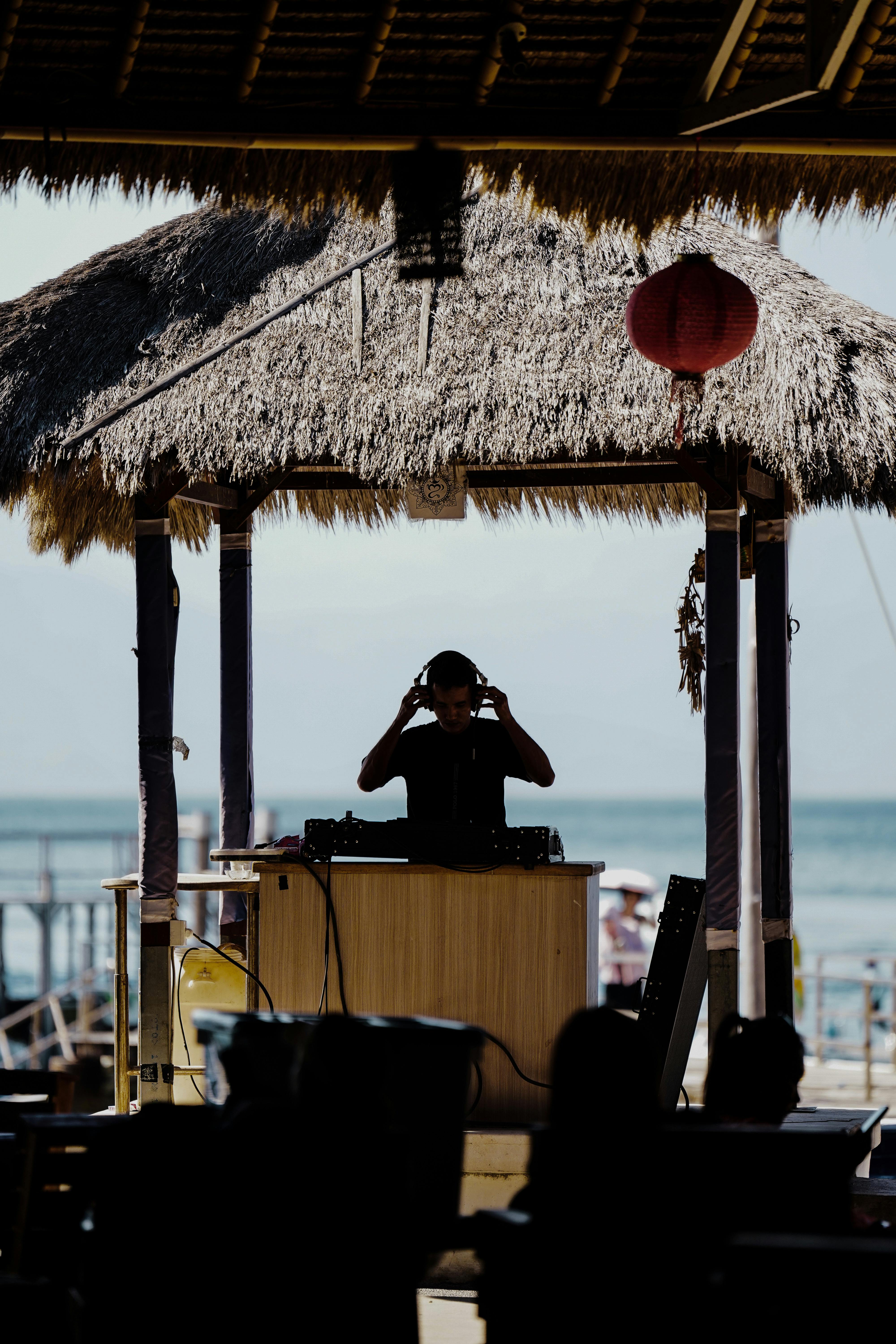 DJ Performing at Beachside Cabana in Bali · Free Stock Photo