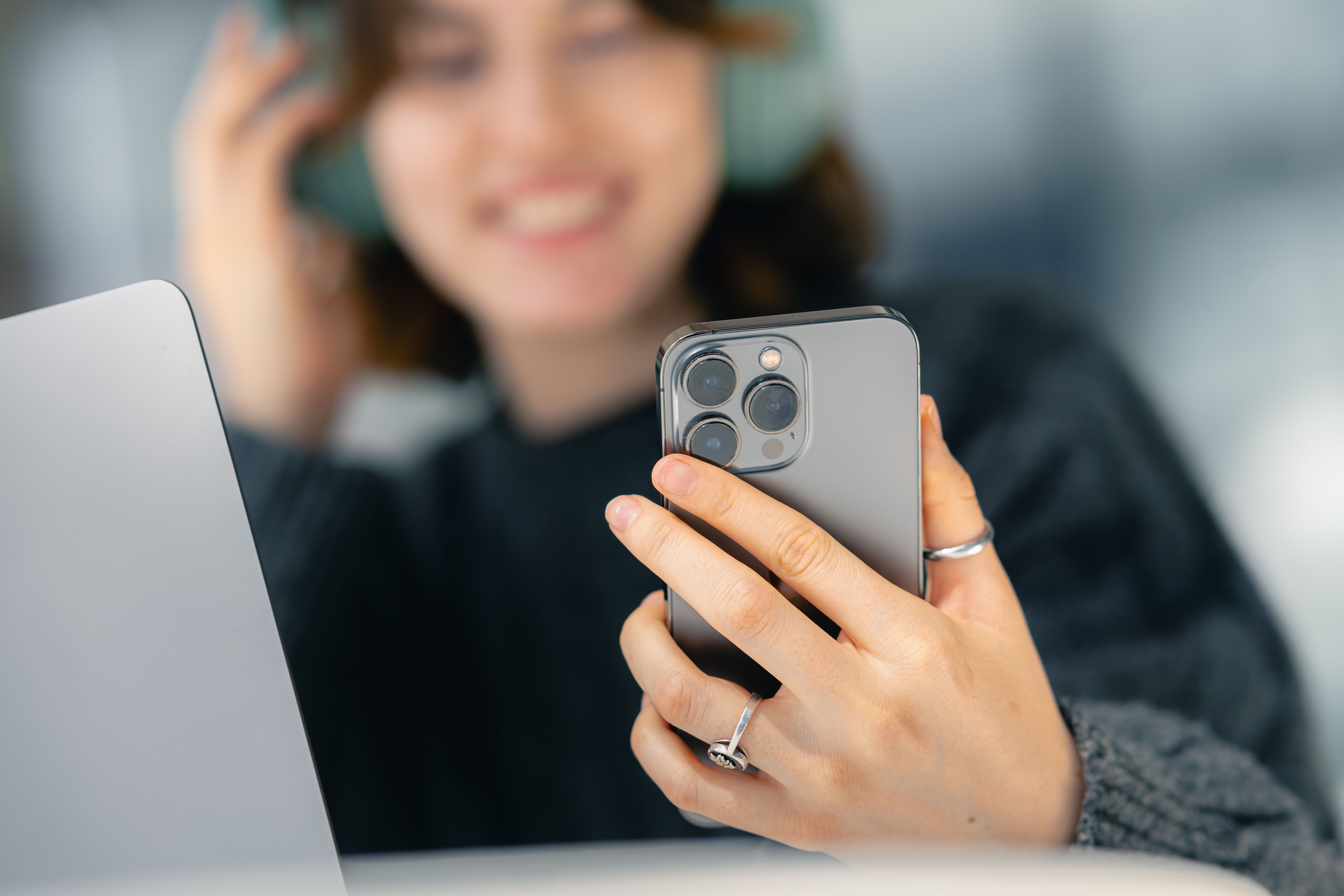 Woman multitasking with phone and online shopping · Free Stock Photo