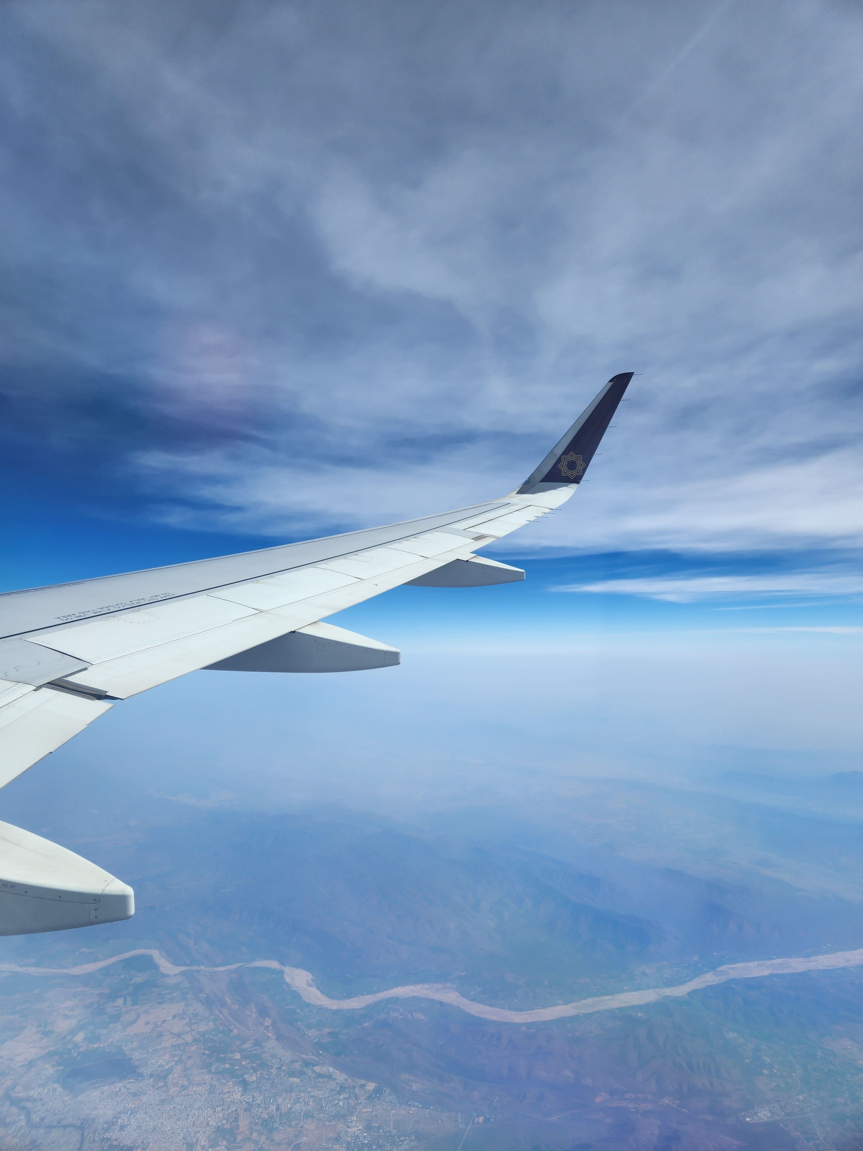Aerial View from Airplane Window Over Landscape · Free Stock Photo