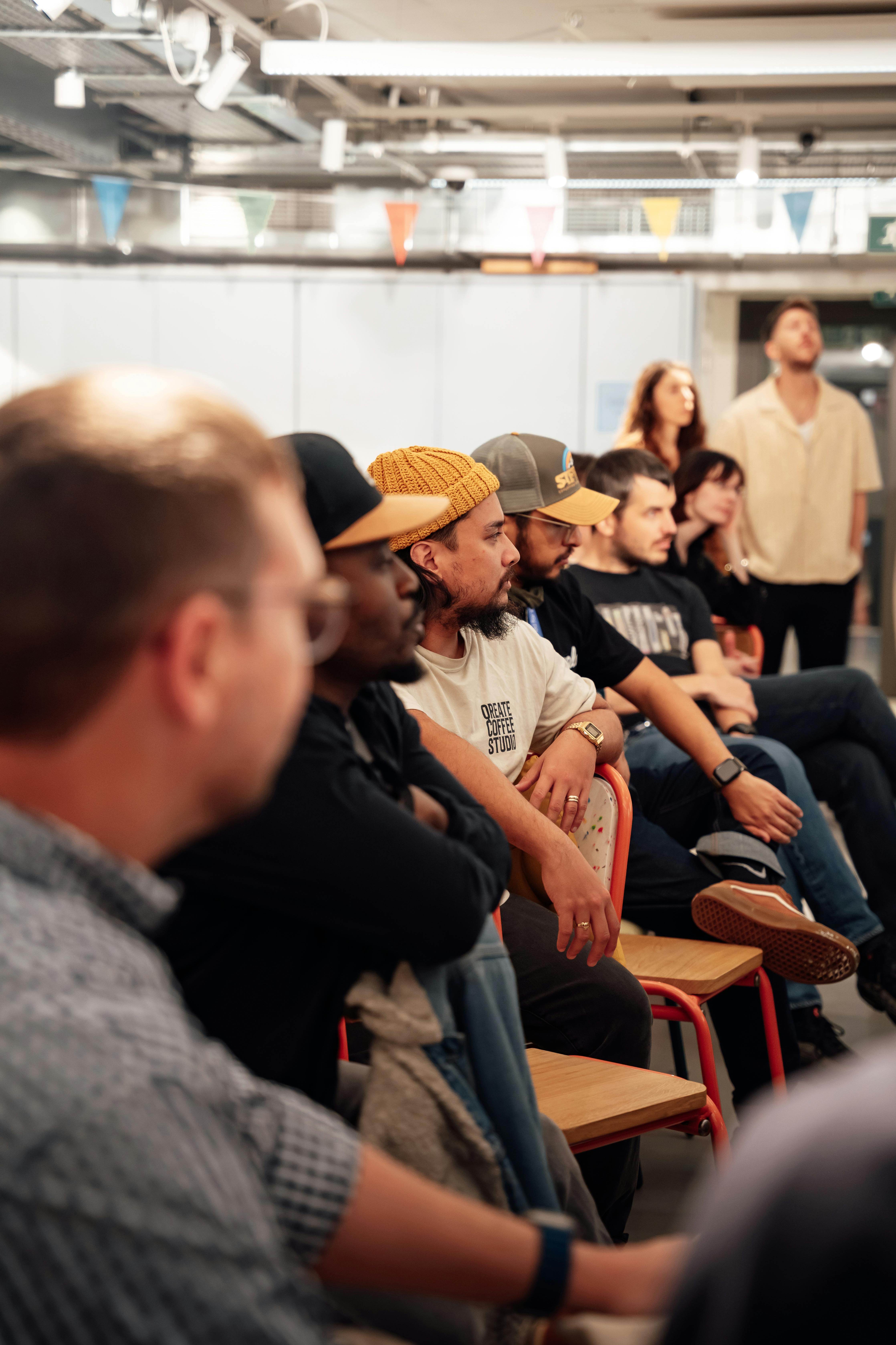 Photo Of People Sitting On Chairs · Free Stock Photo