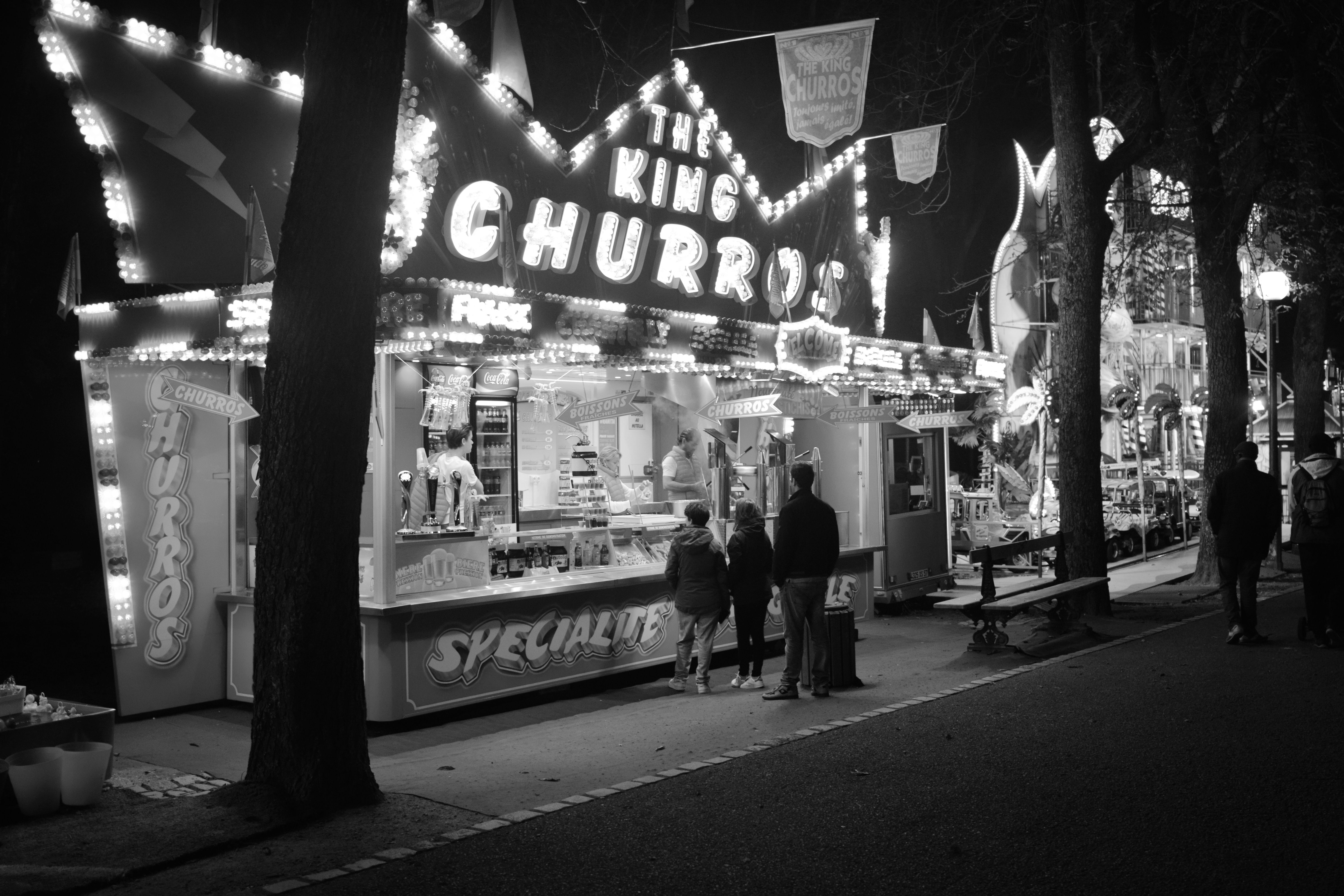 Nighttime Churros Stand at Amusement Park · Free Stock Photo