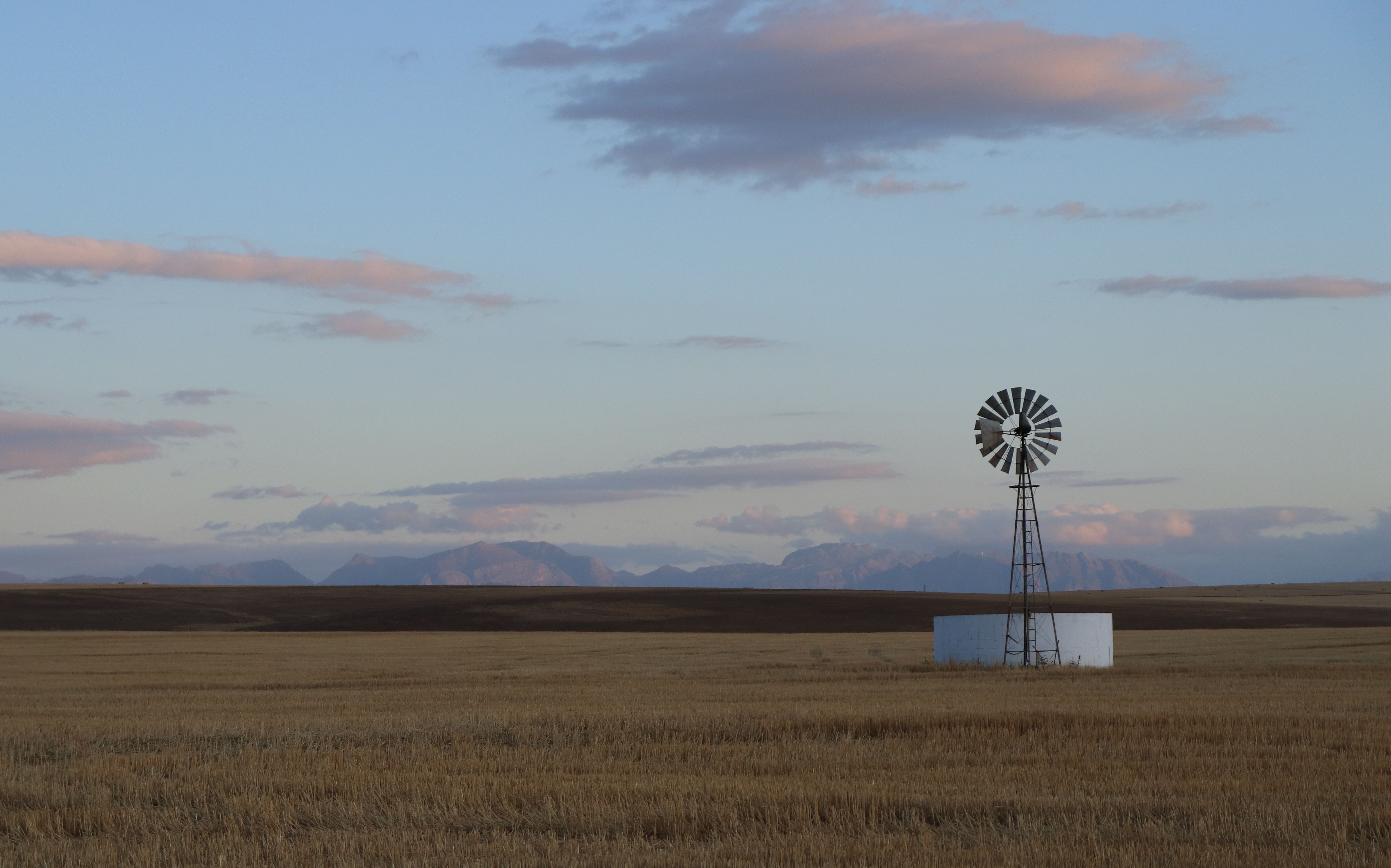 Gray Windmill on Brown Field · Free Stock Photo
