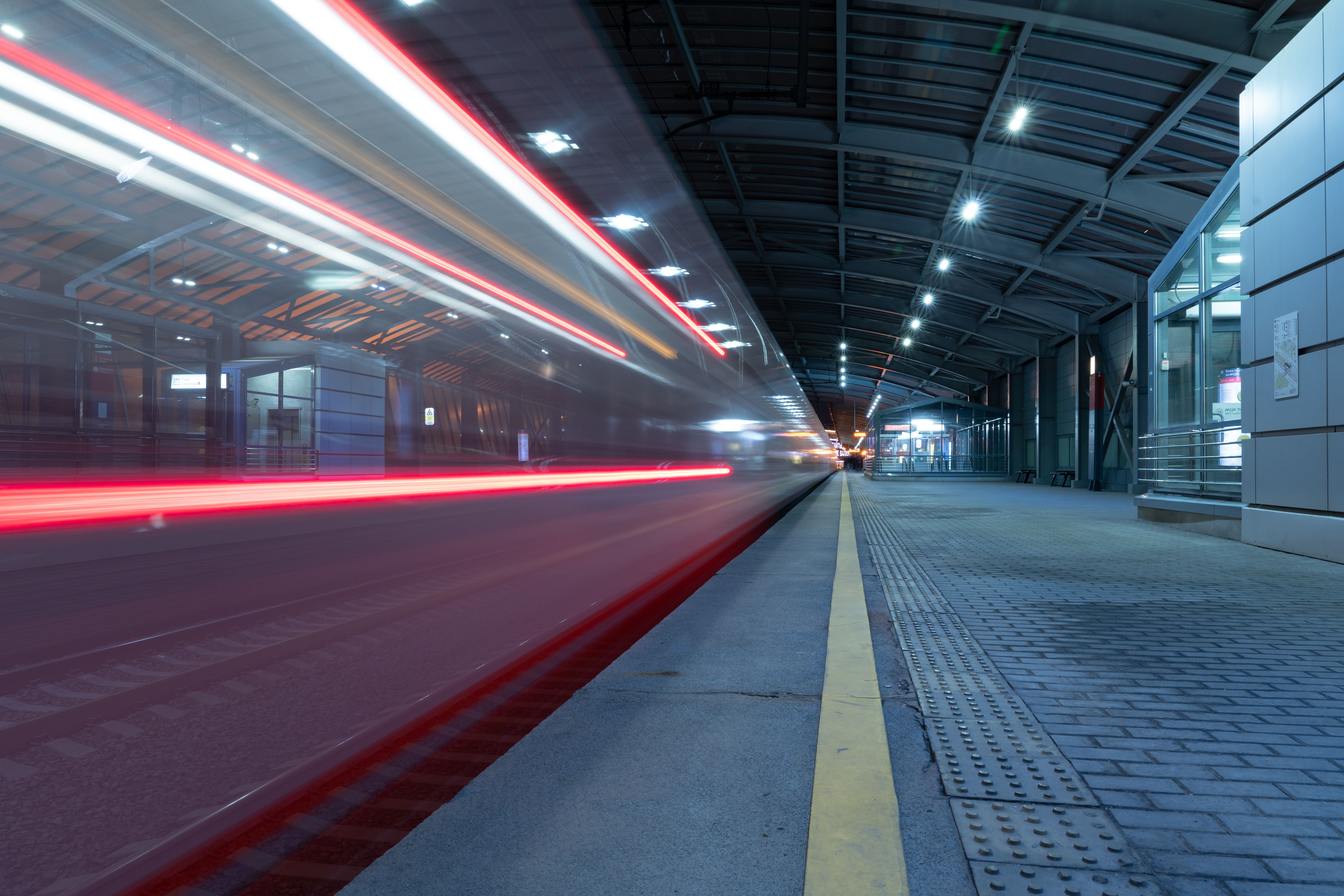 Dynamic Nighttime Train Station with Motion Blur · Free Stock Photo