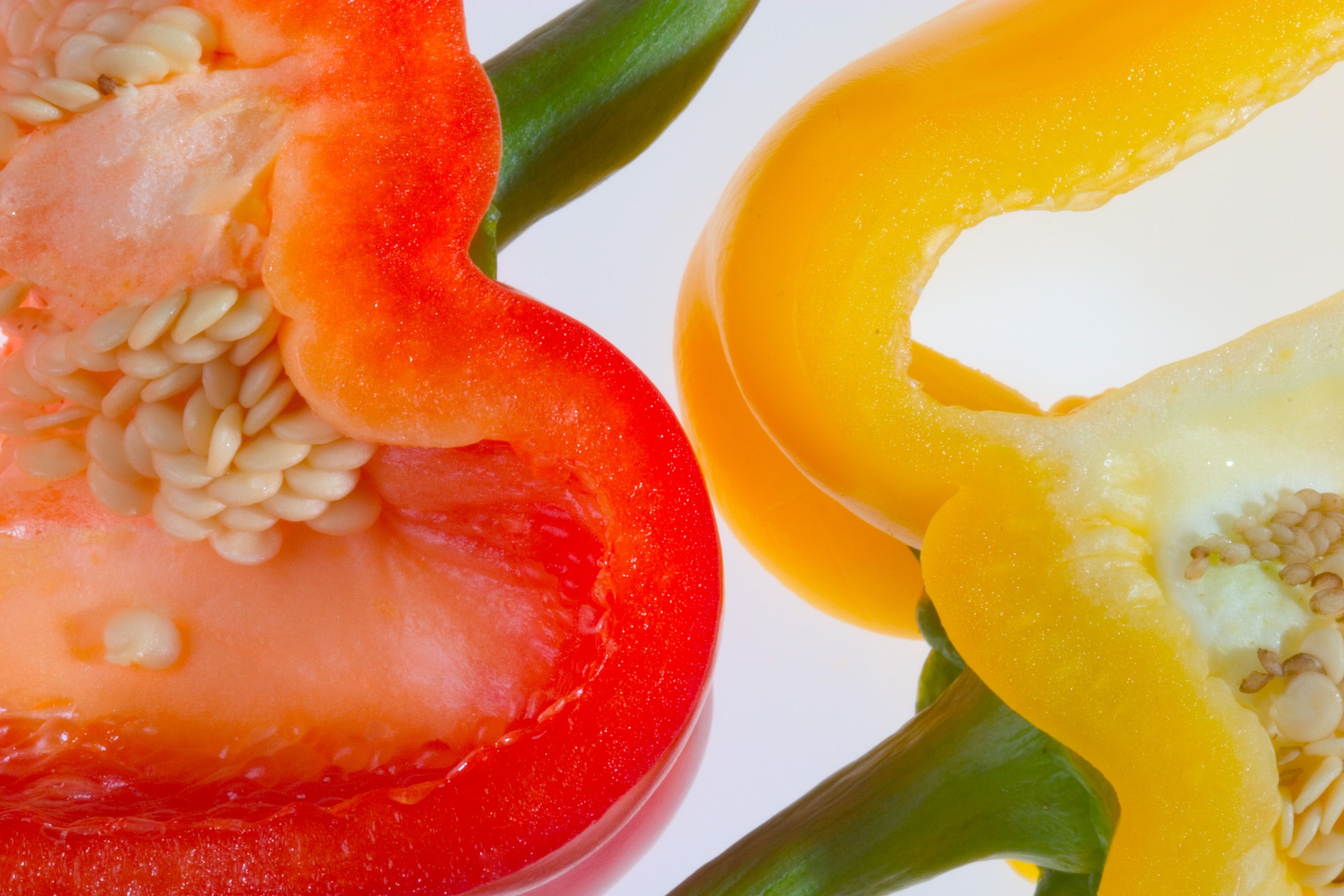 Vibrant Bell Peppers Sliced Close-up · Free Stock Photo