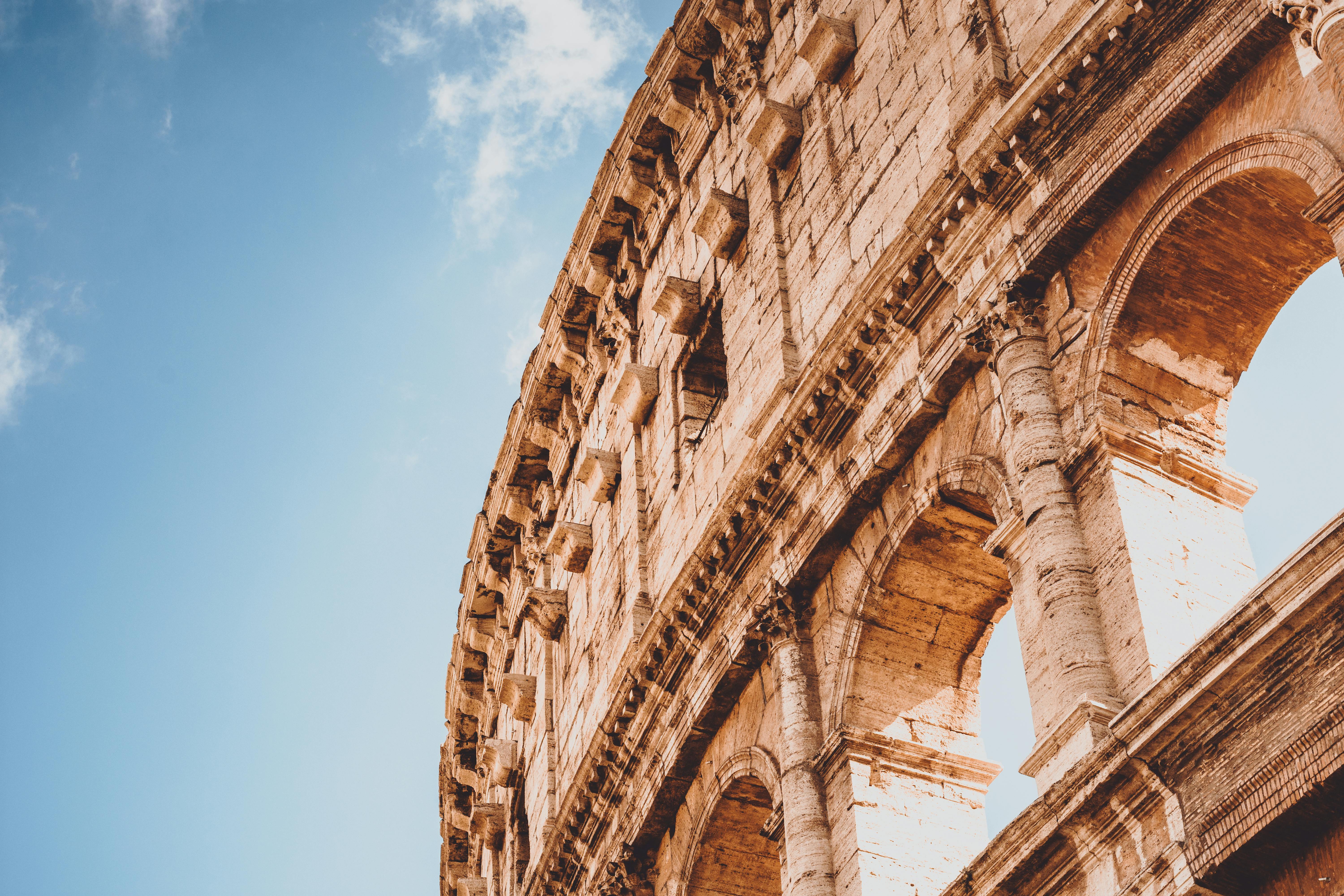 Historic Colosseum in Rome against blue sky · Free Stock Photo