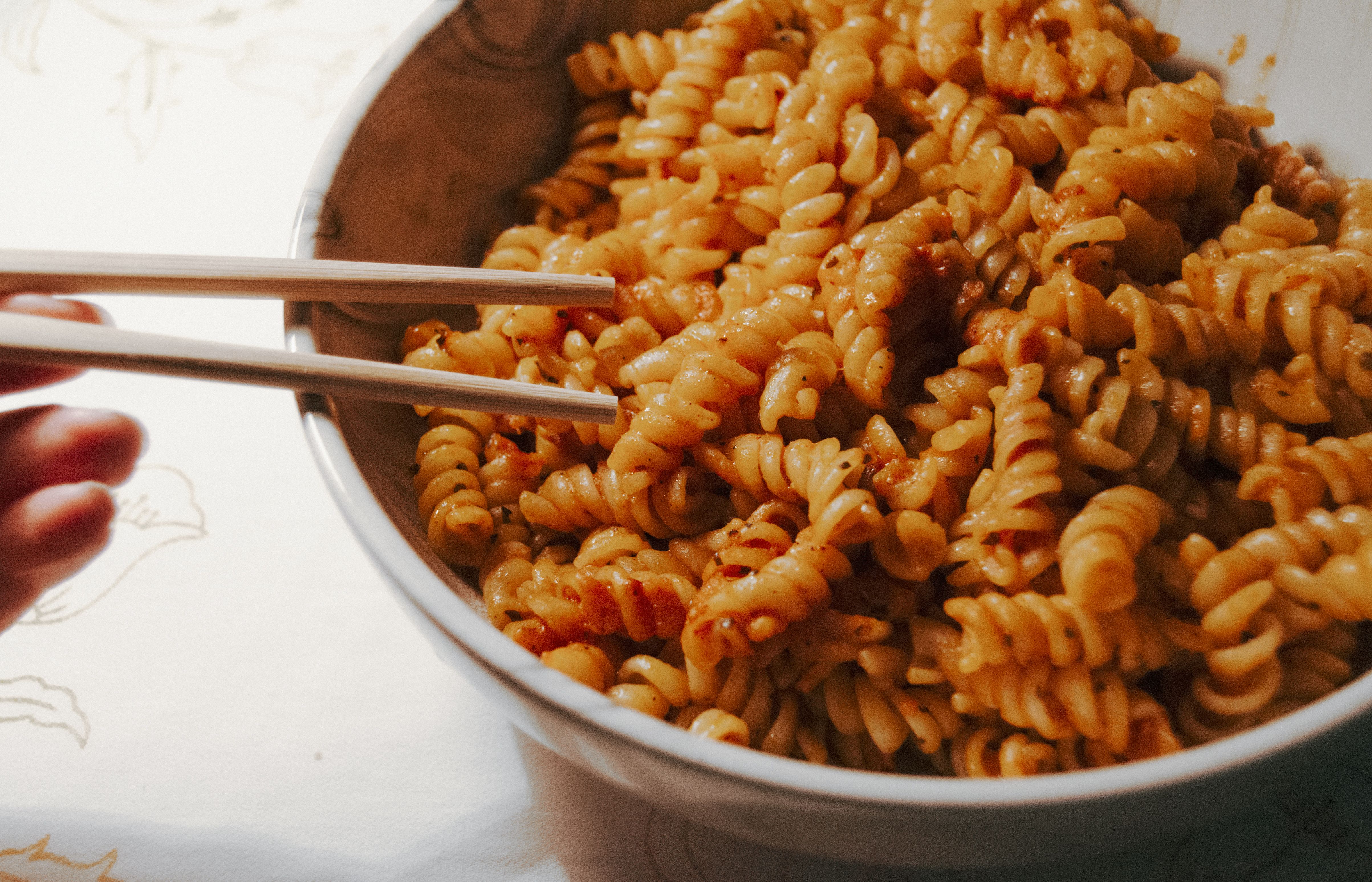 Close-up of Spiral Pasta with Chopsticks · Free Stock Photo