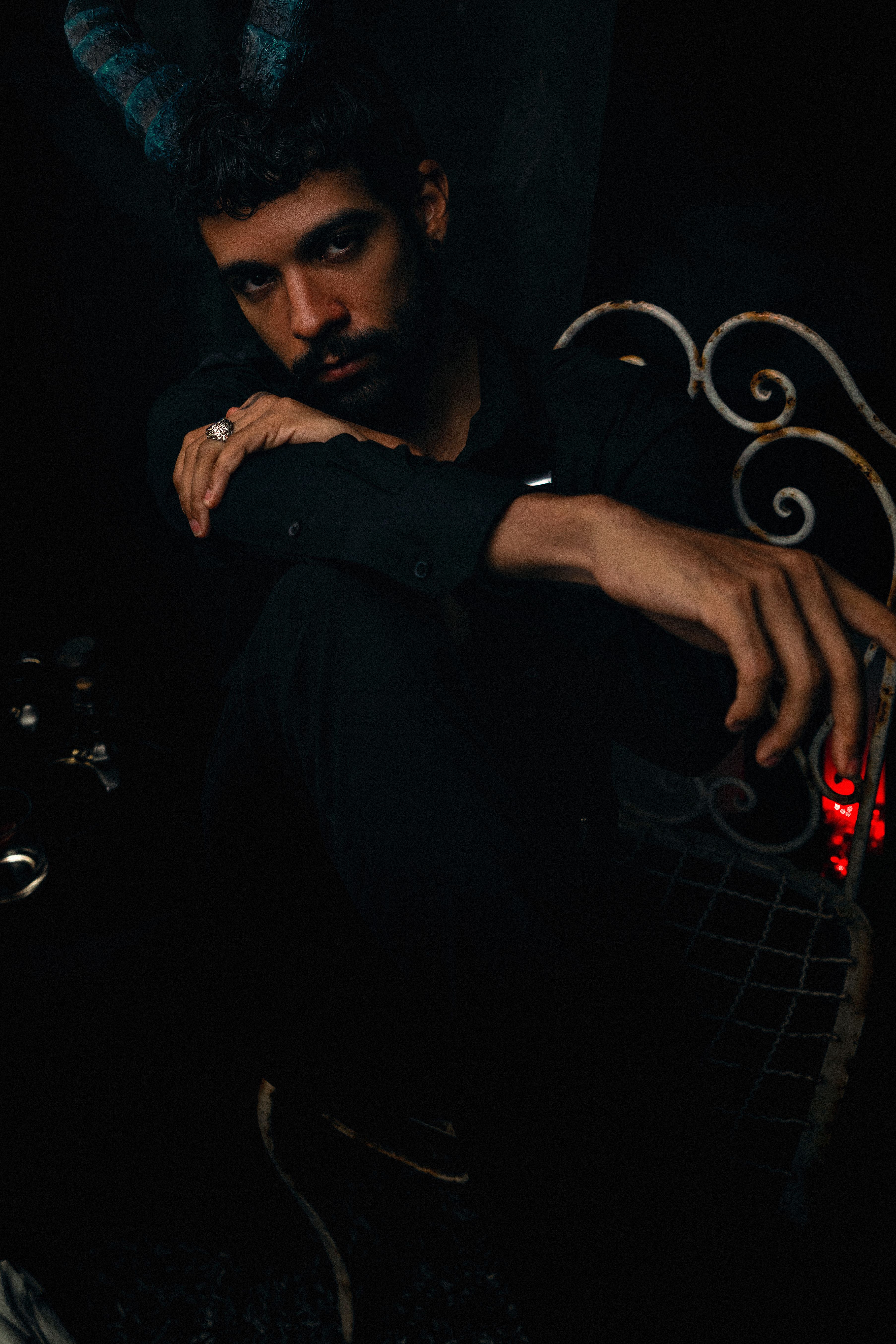 Moody Portrait of a Man with Dark Horns · meta.free_stock.photo