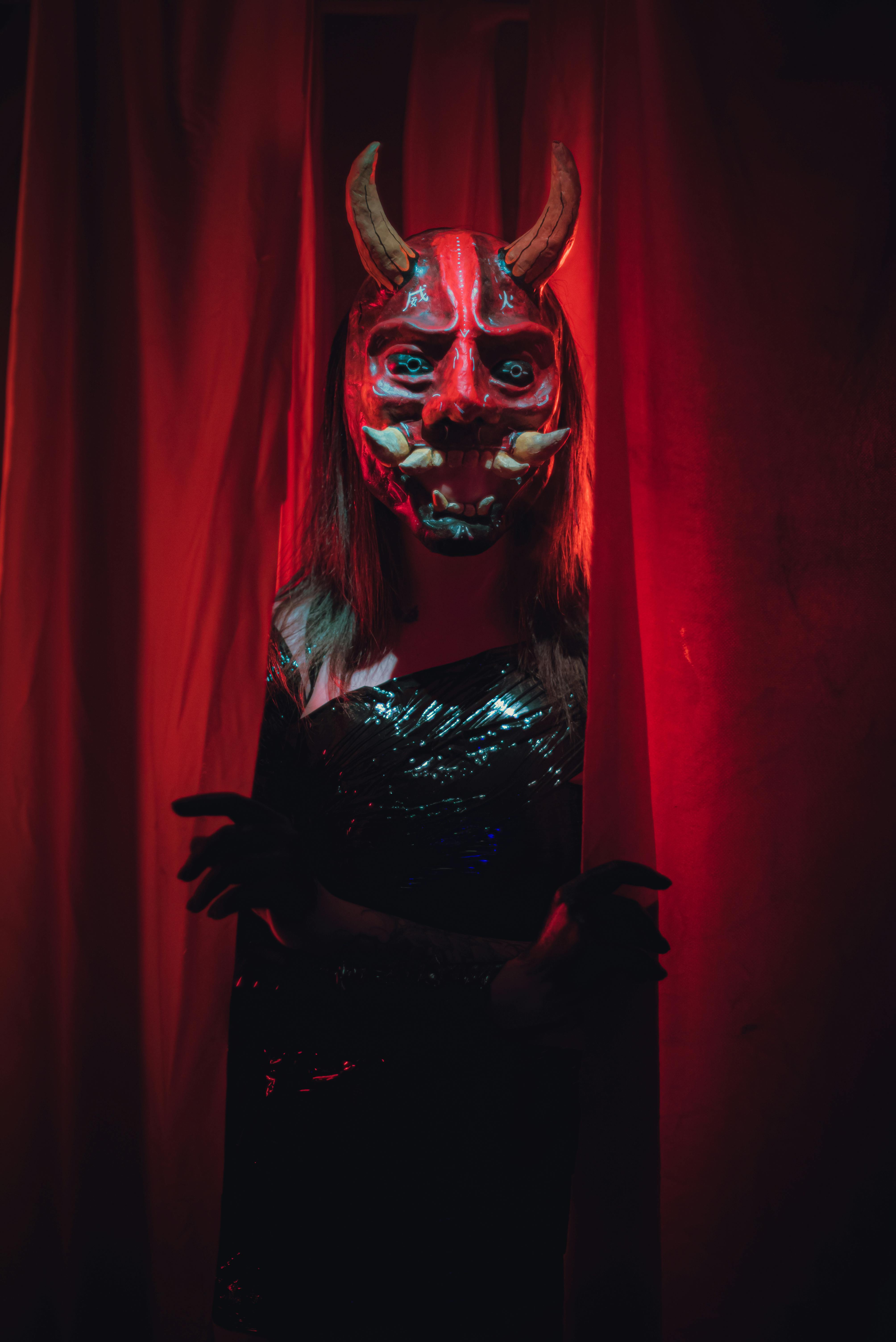 Mysterious Figure in Demon Mask with Red Lighting · Free Stock Photo