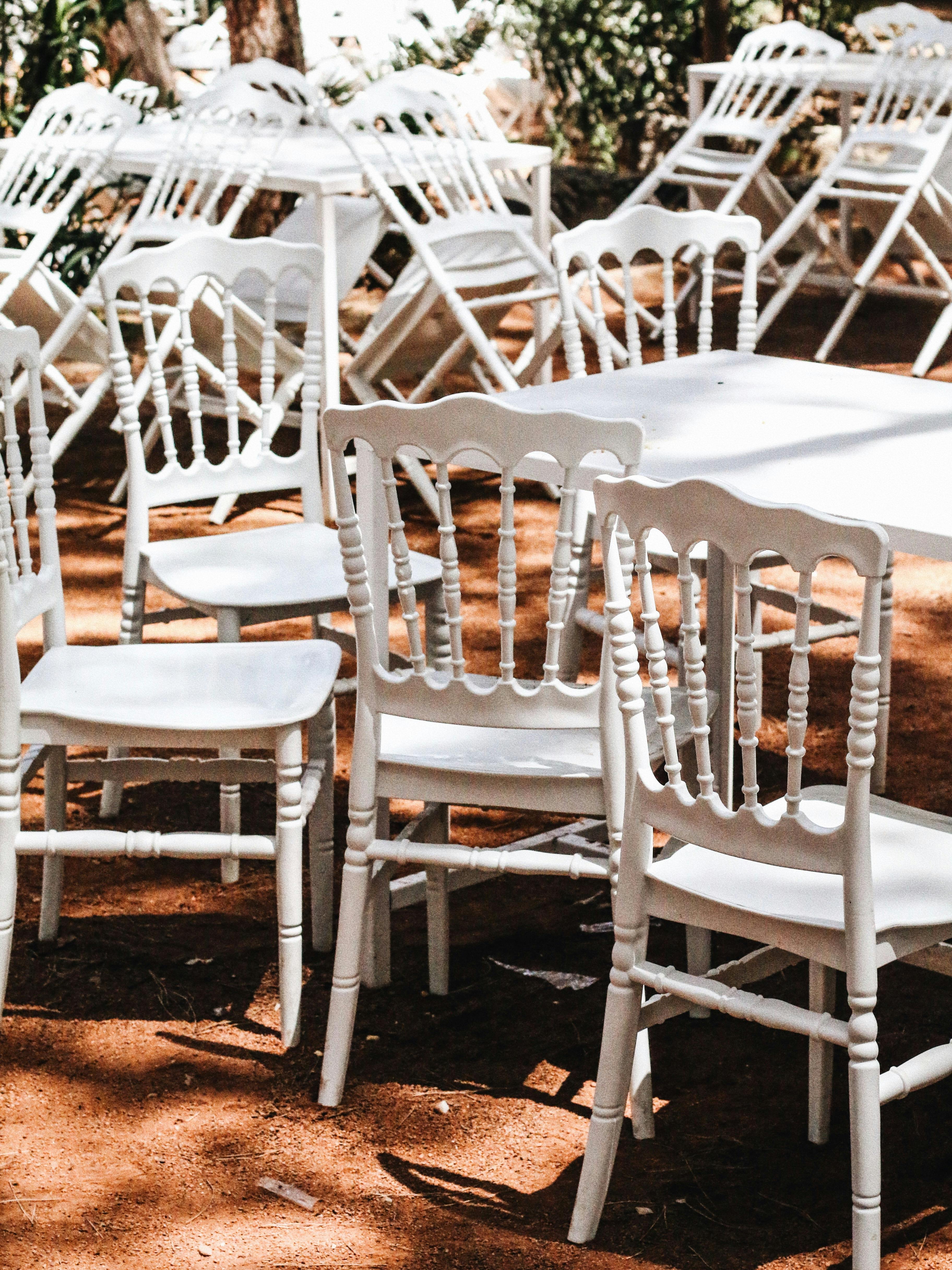 Banquet wooden table and chairs on terrace near lake · Free Stock Photo