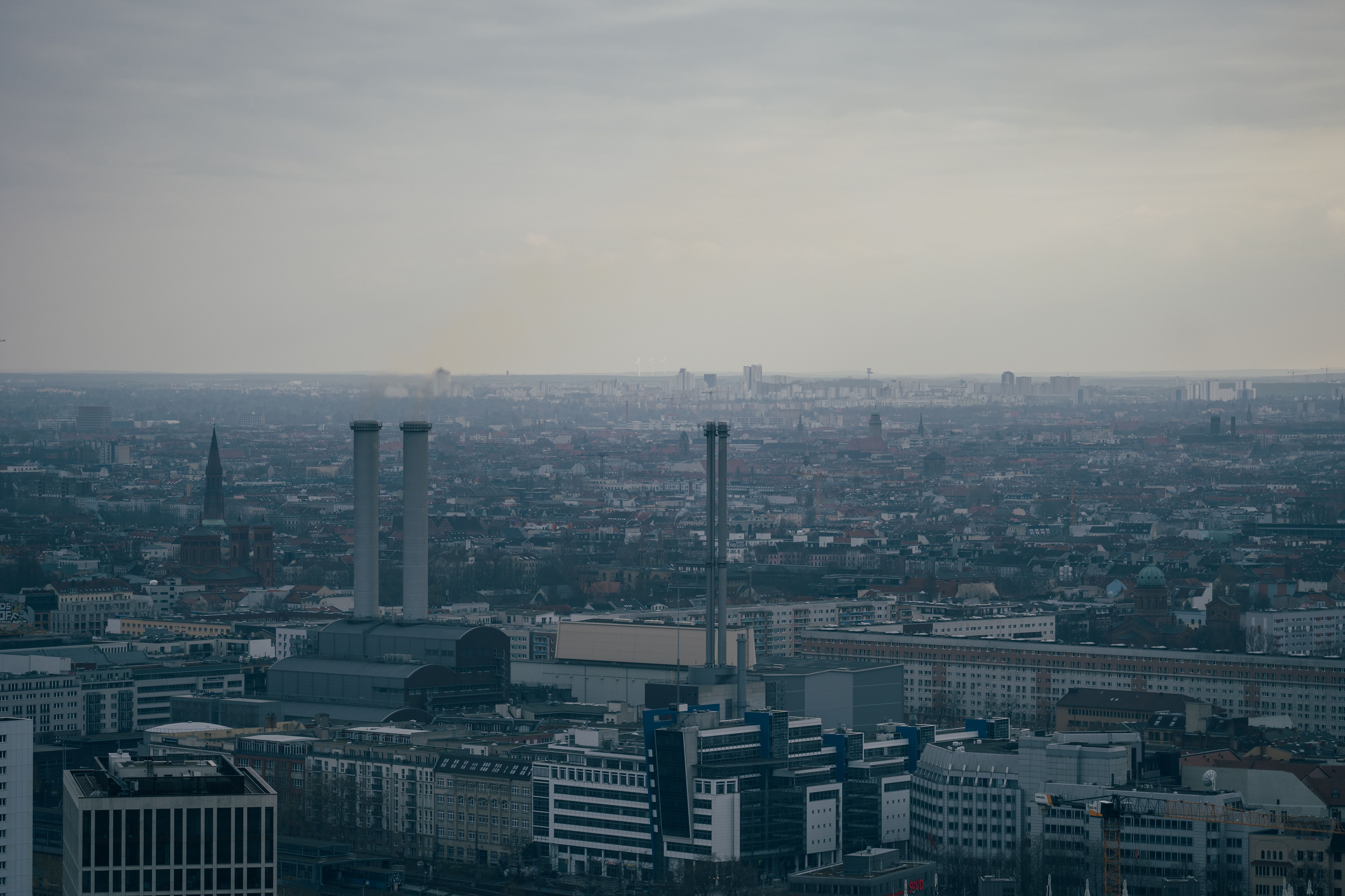 Aerial View of Industrial Cityscape Under Overcast Sky · Free Stock Photo