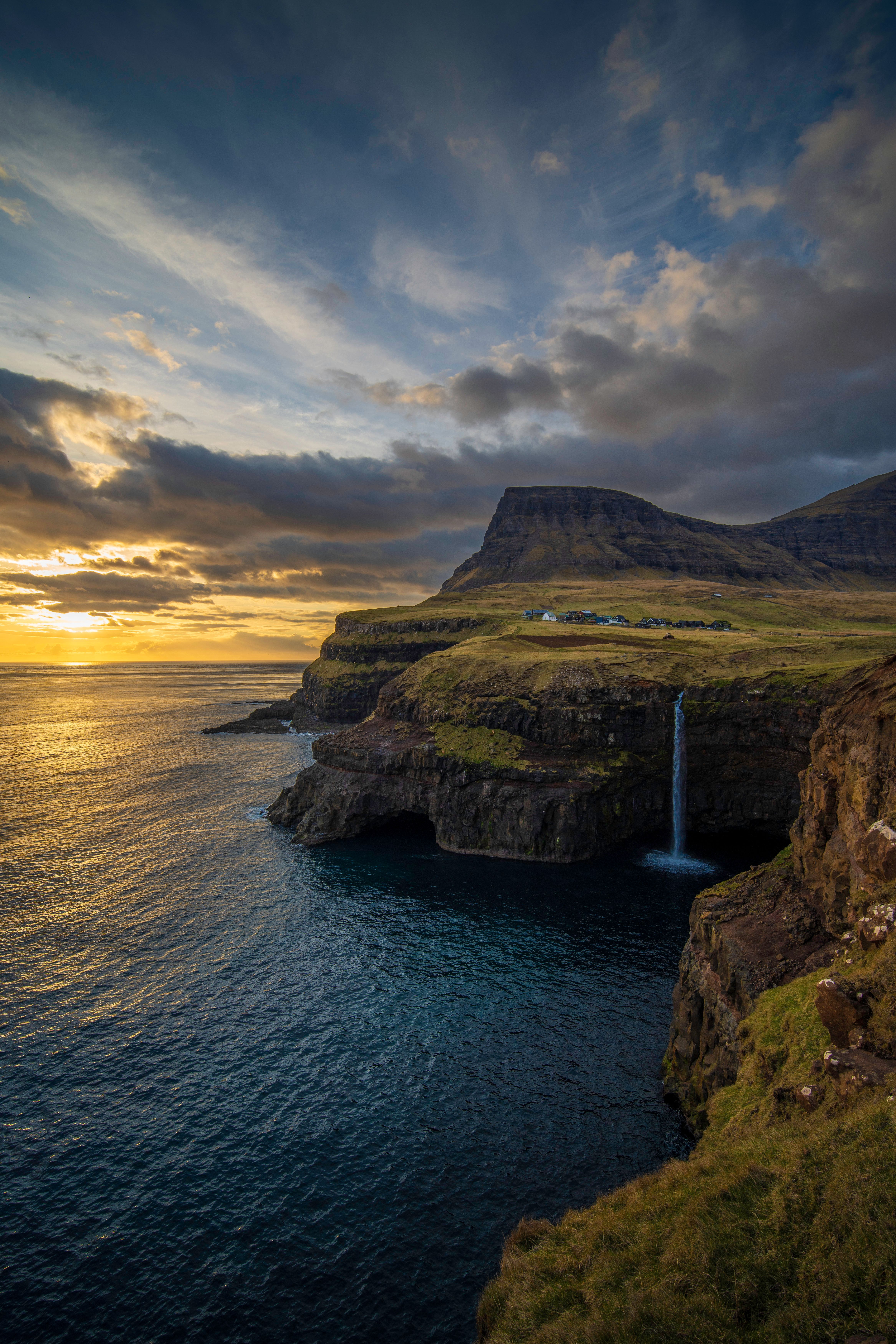 Stunning Sunset Over Múlafossur Waterfall, Faroe Islands · Free Stock Photo