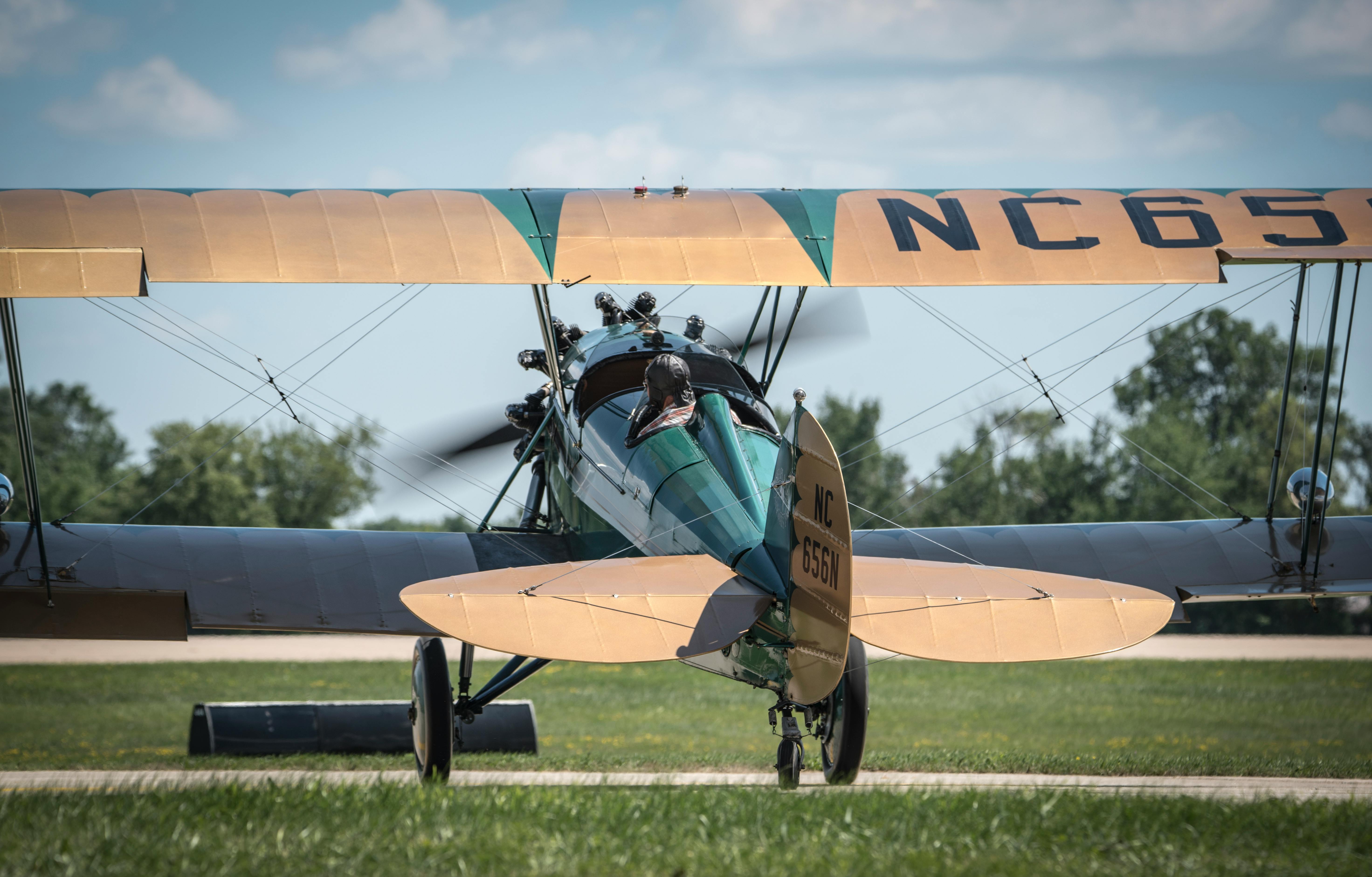Historic Biplane on Sunny Day at Airstrip · Free Stock Photo