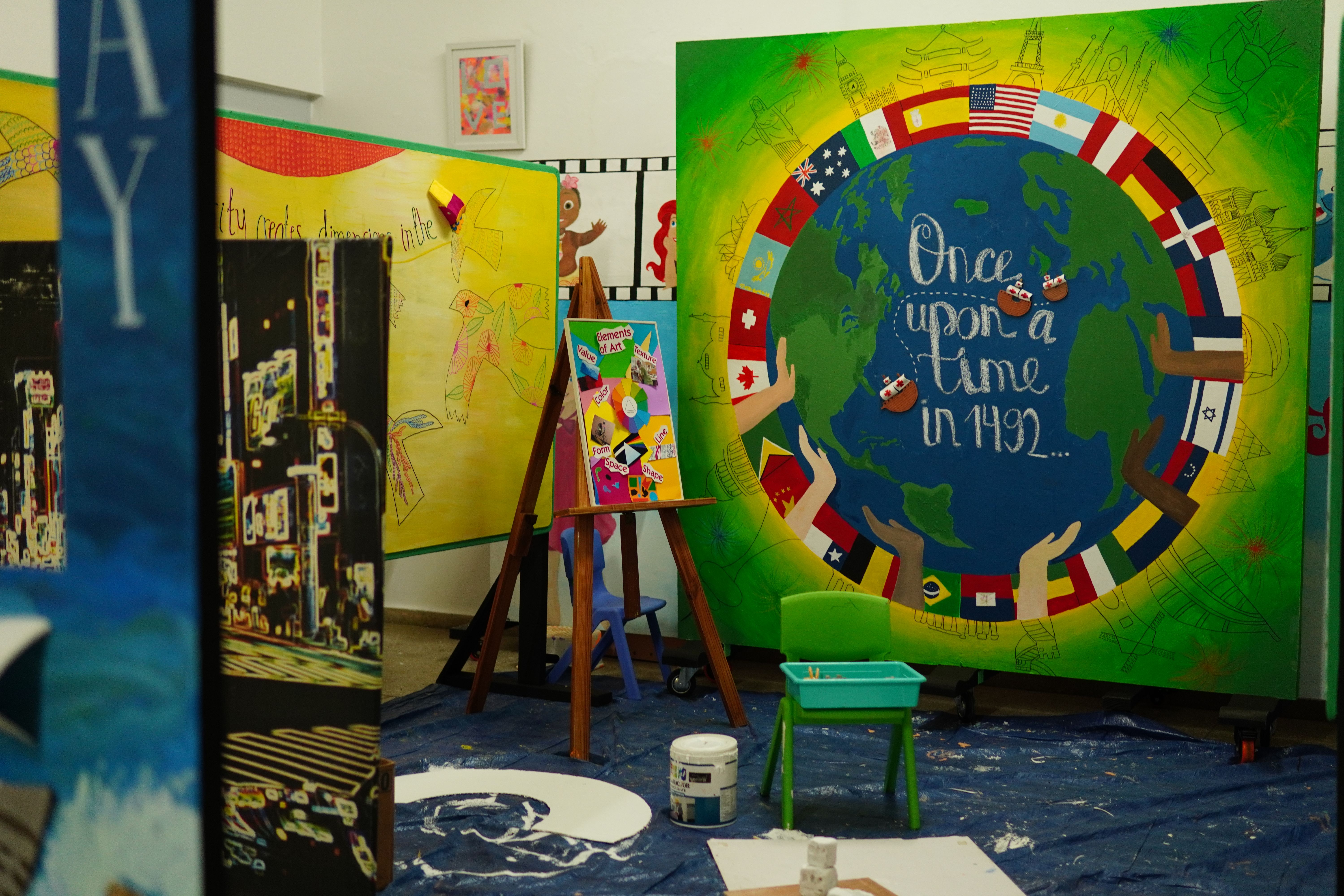 Colorful Art Classroom with World Map Mural · Free Stock Photo