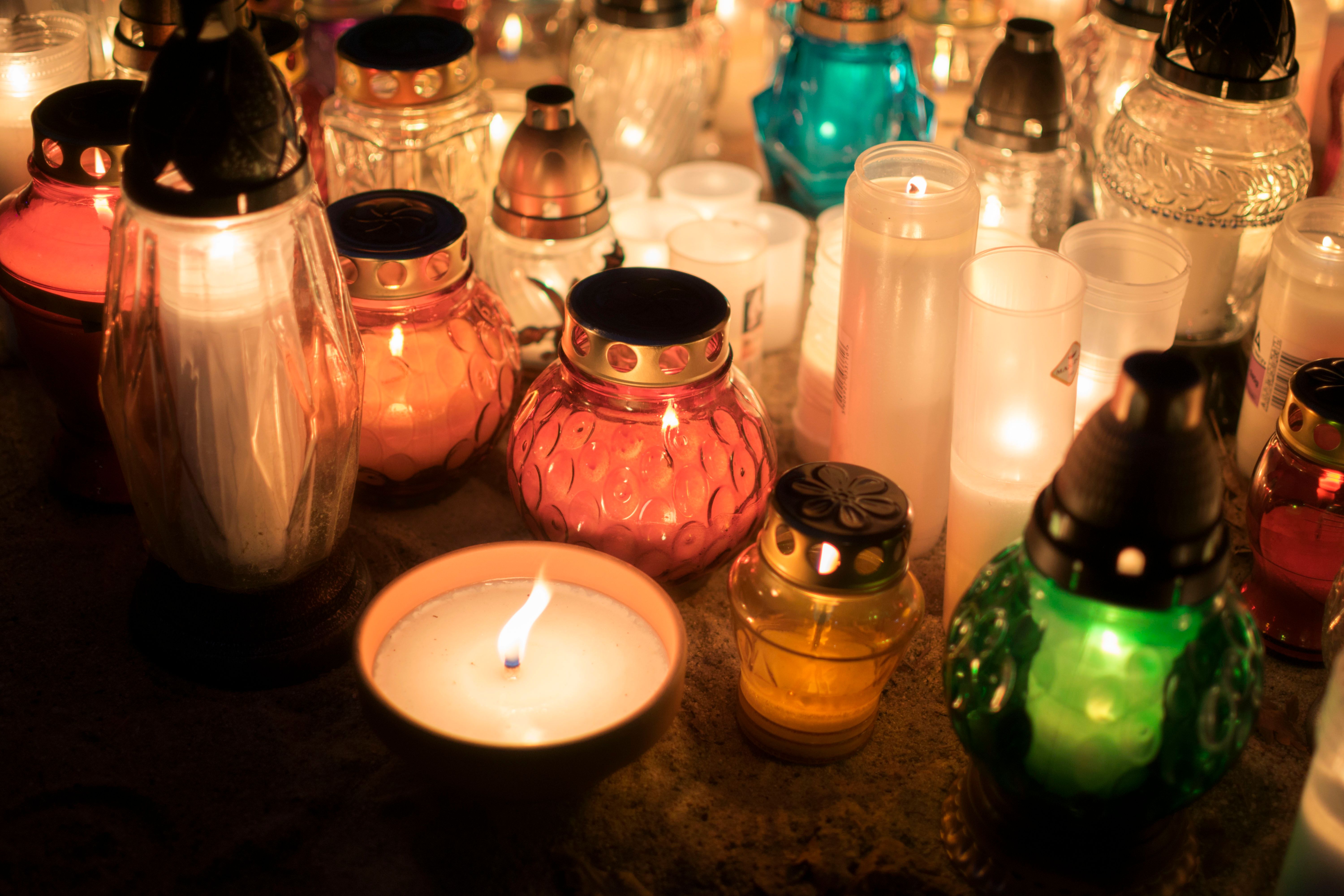 Votive Candles Illuminating a Memorial Tribute · Free Stock Photo