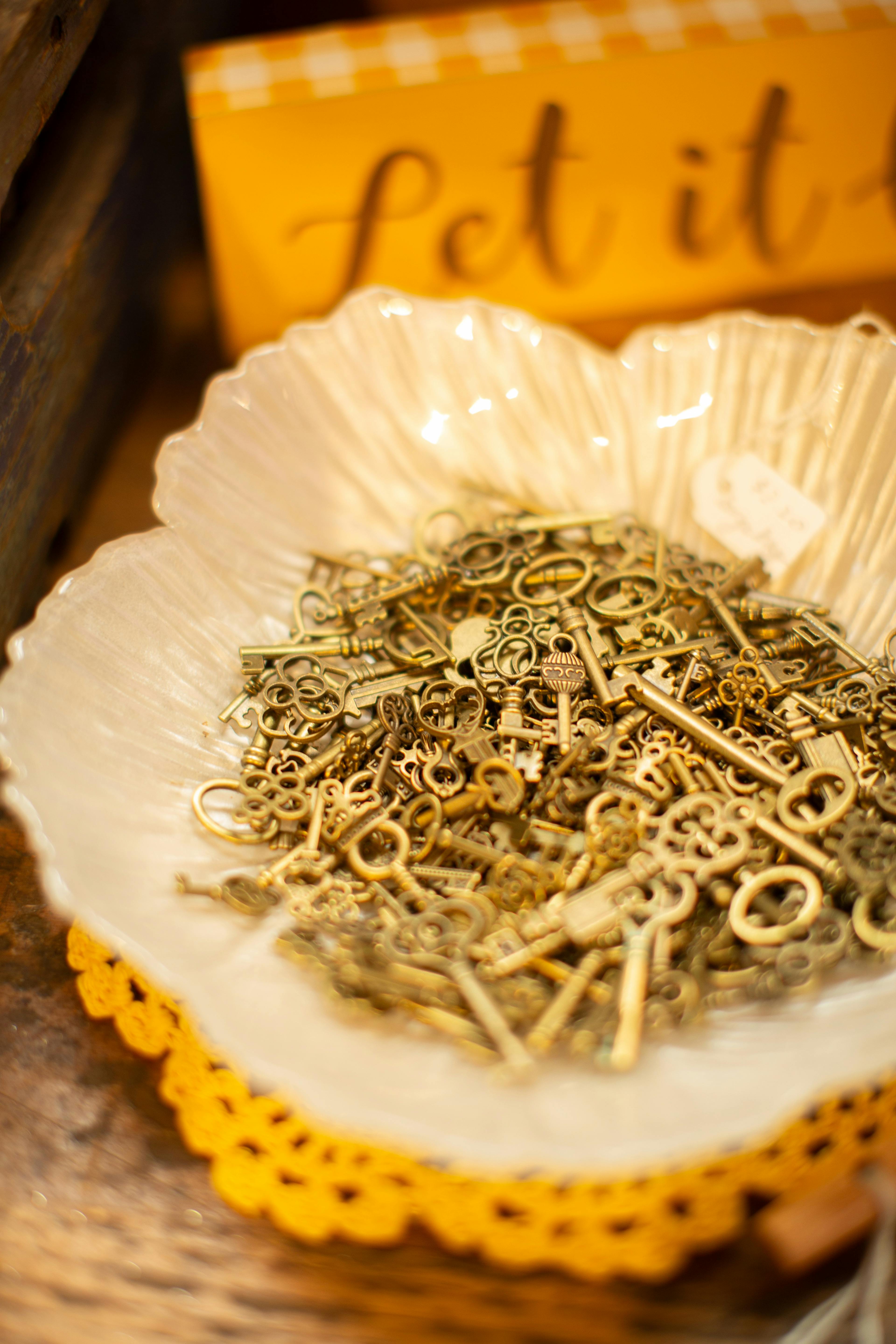 Vintage Brass Keys in Decorative Bowl · Free Stock Photo