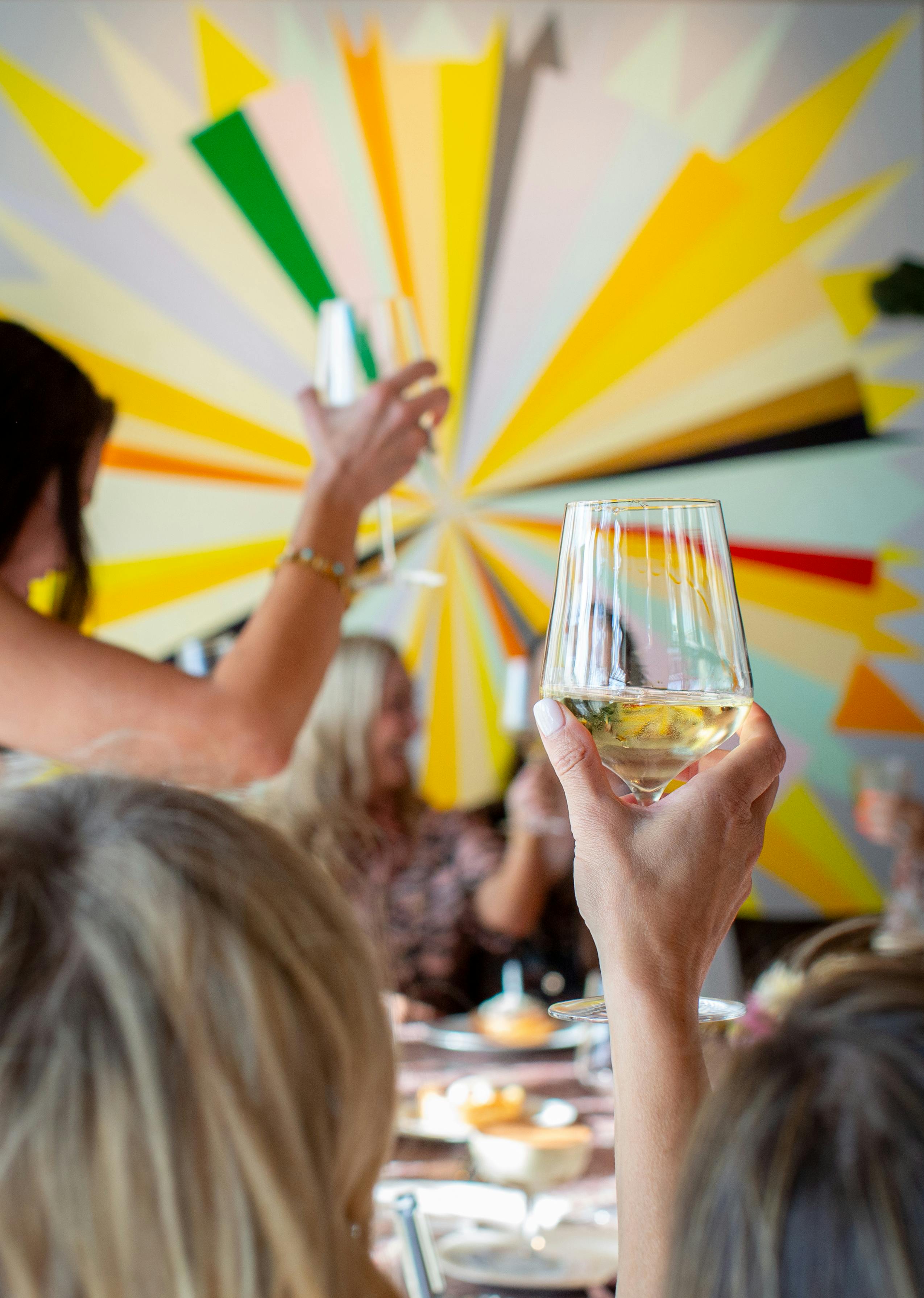 Celebratory Toast at Vibrant Gathering in Byron Bay · Free Stock Photo