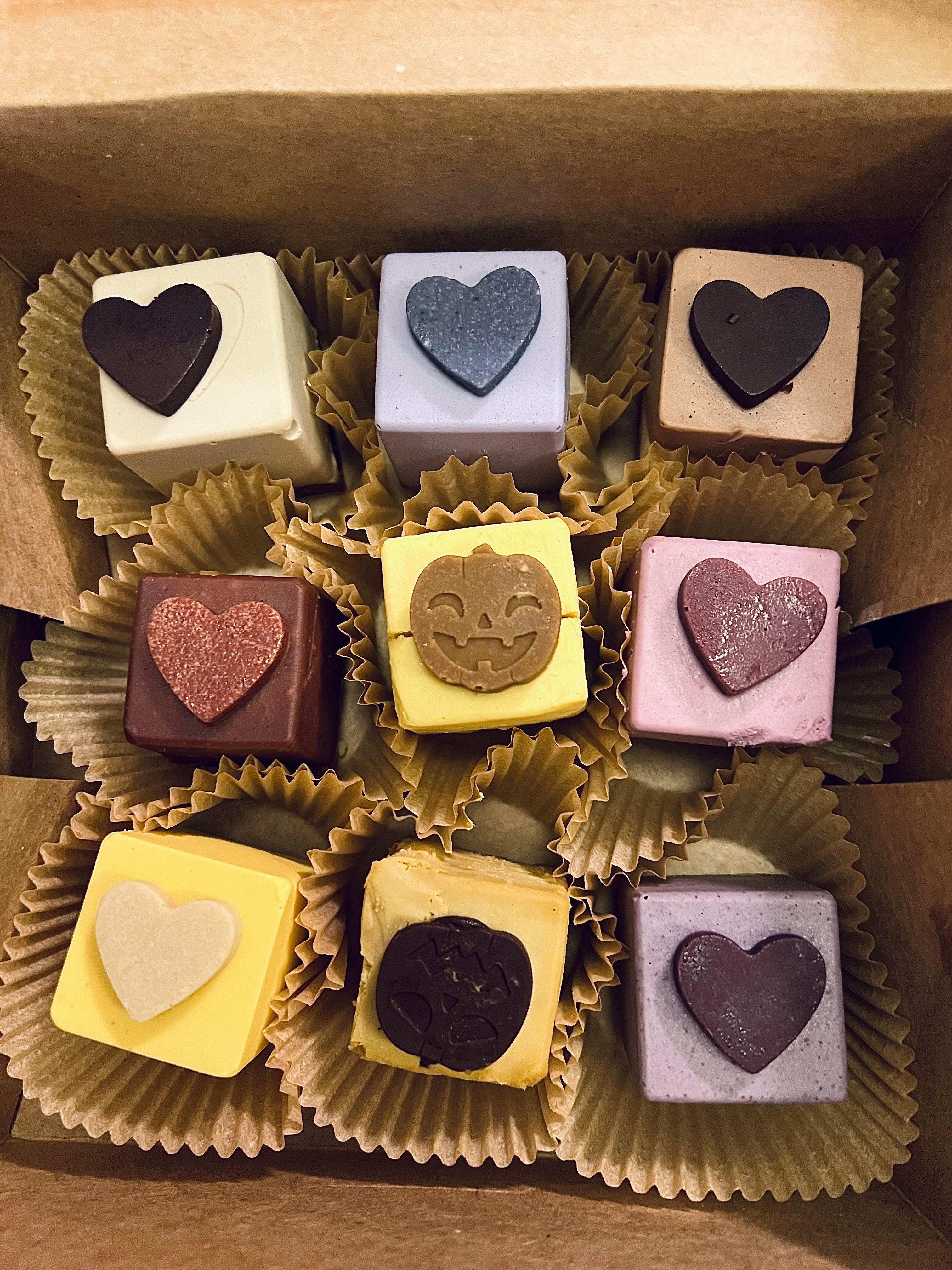 Assorted Chocolate Cubes with Decorative Hearts · Free Stock Photo