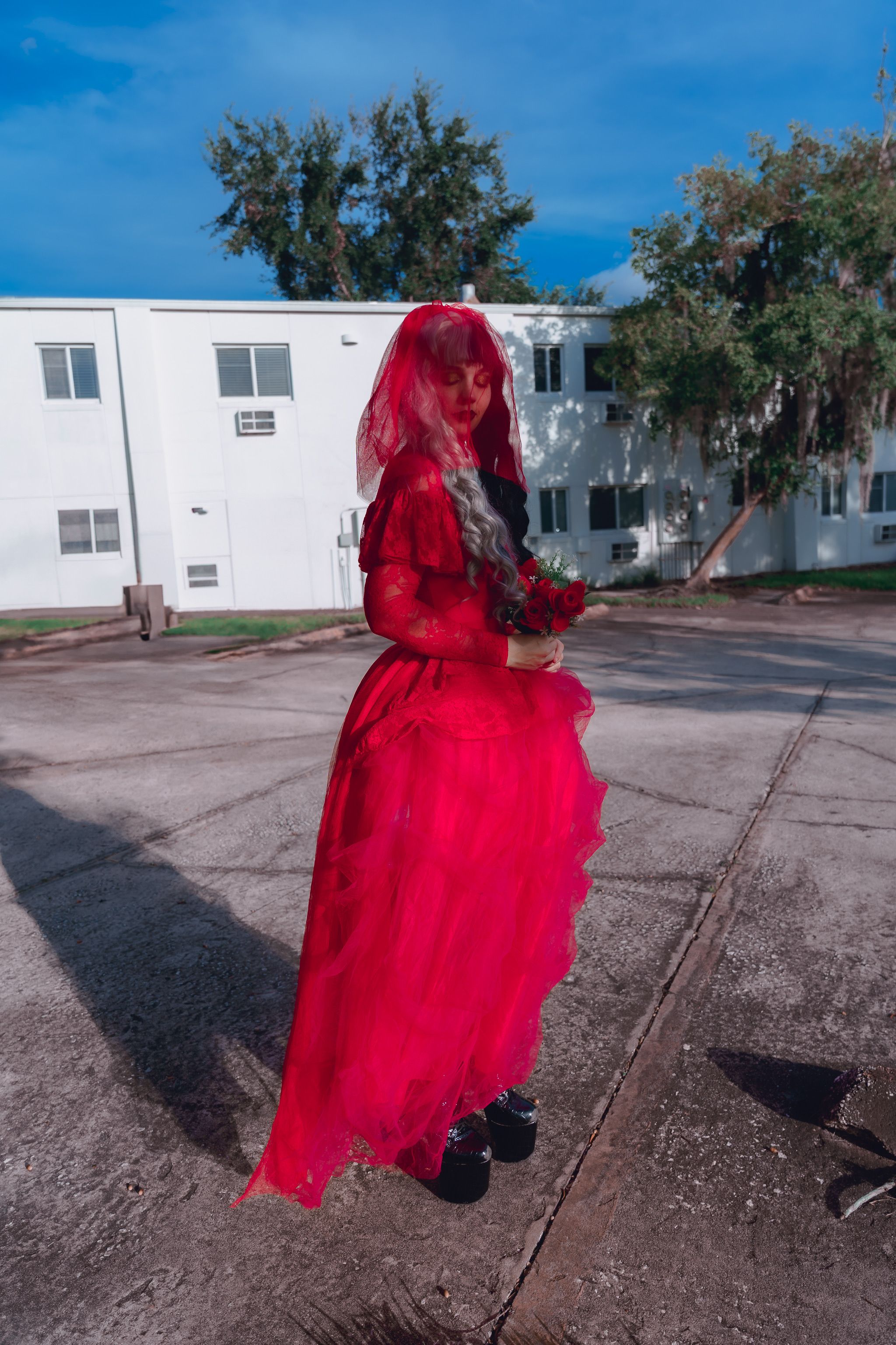 Woman in Red Veil Outdoors in Residential Area · Free Stock Photo