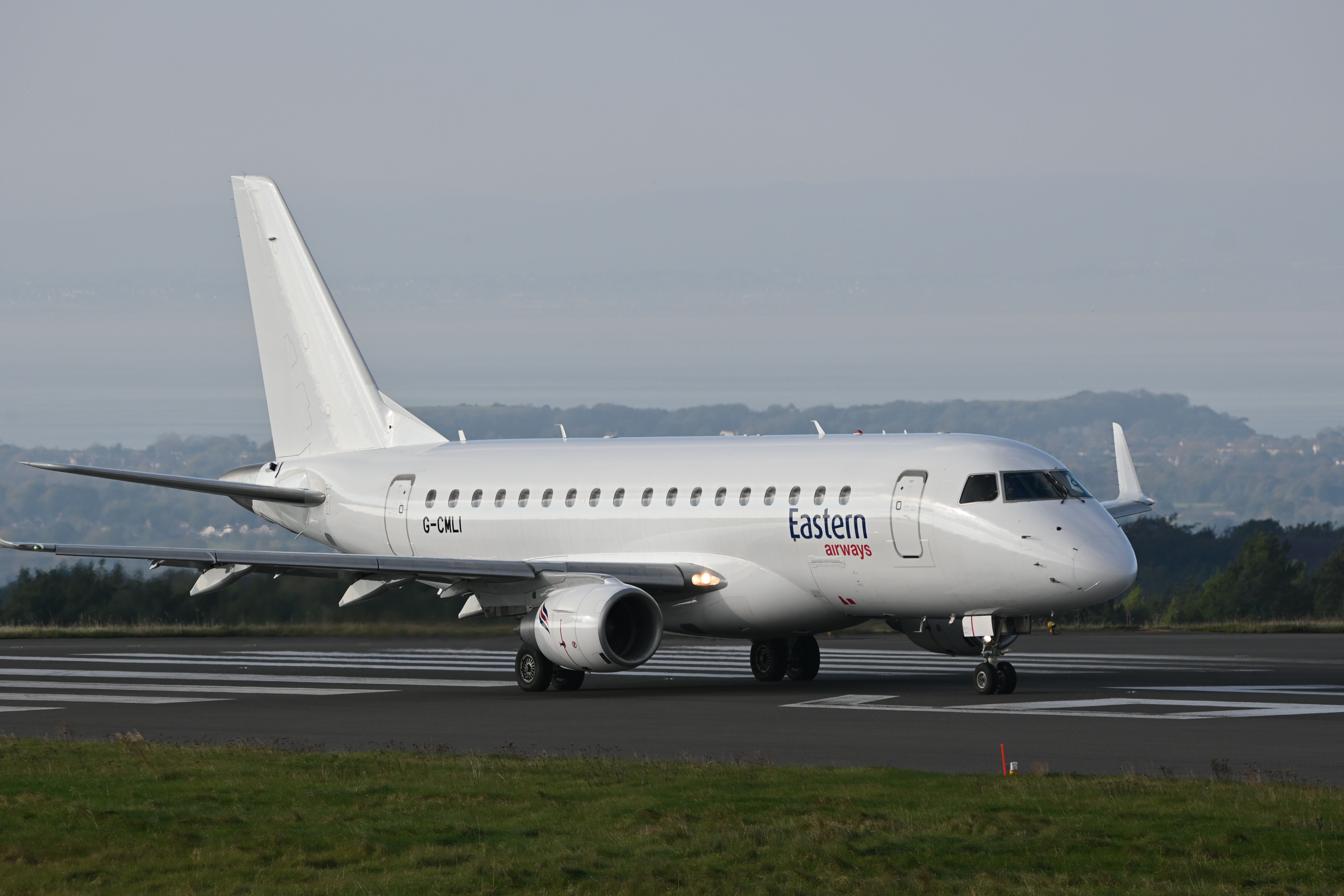 Eastern Airways Embraer Jet Taxiing on Runway · Free Stock Photo
