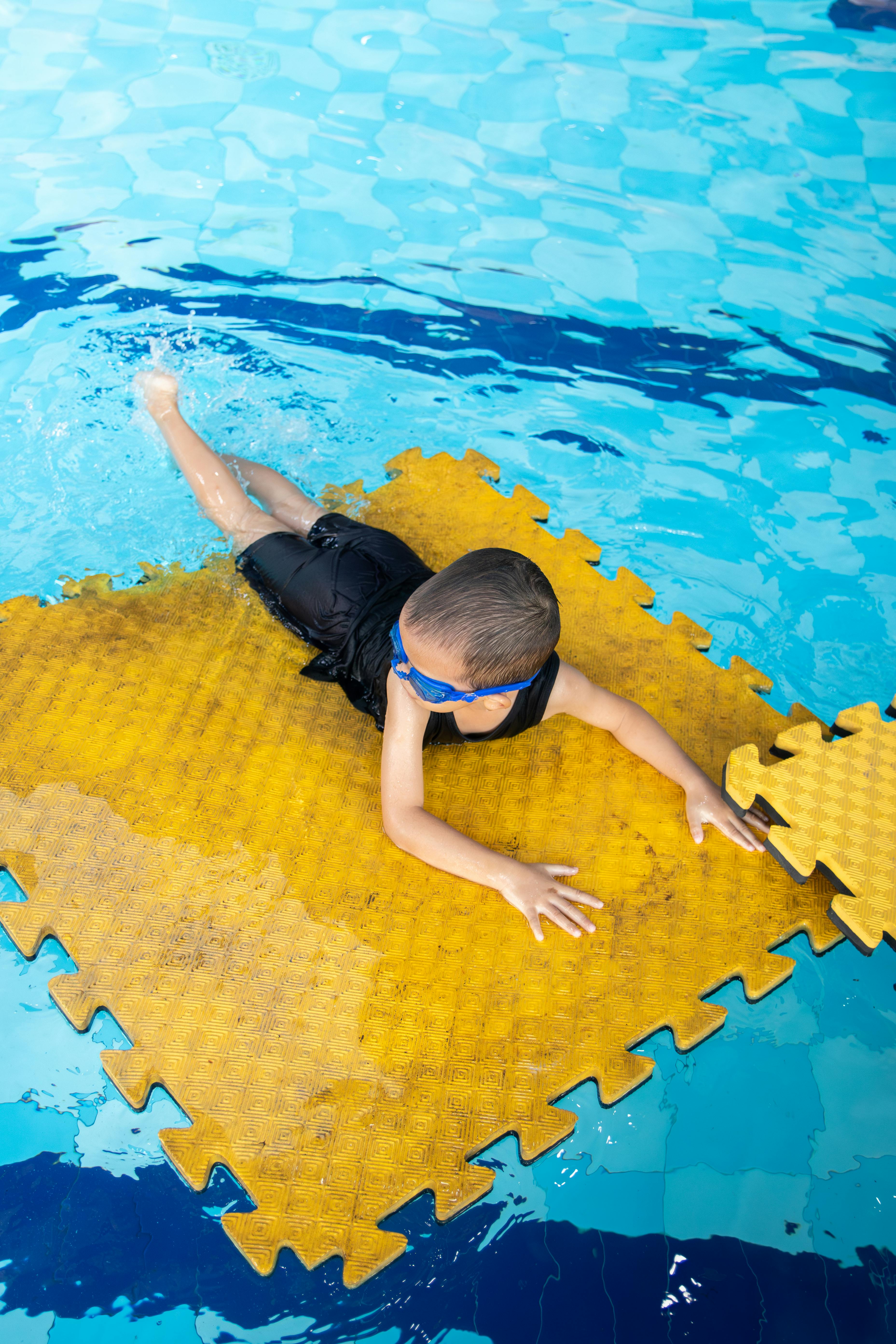 Child Enjoying Float in Vietnamese Pool · Free Stock Photo