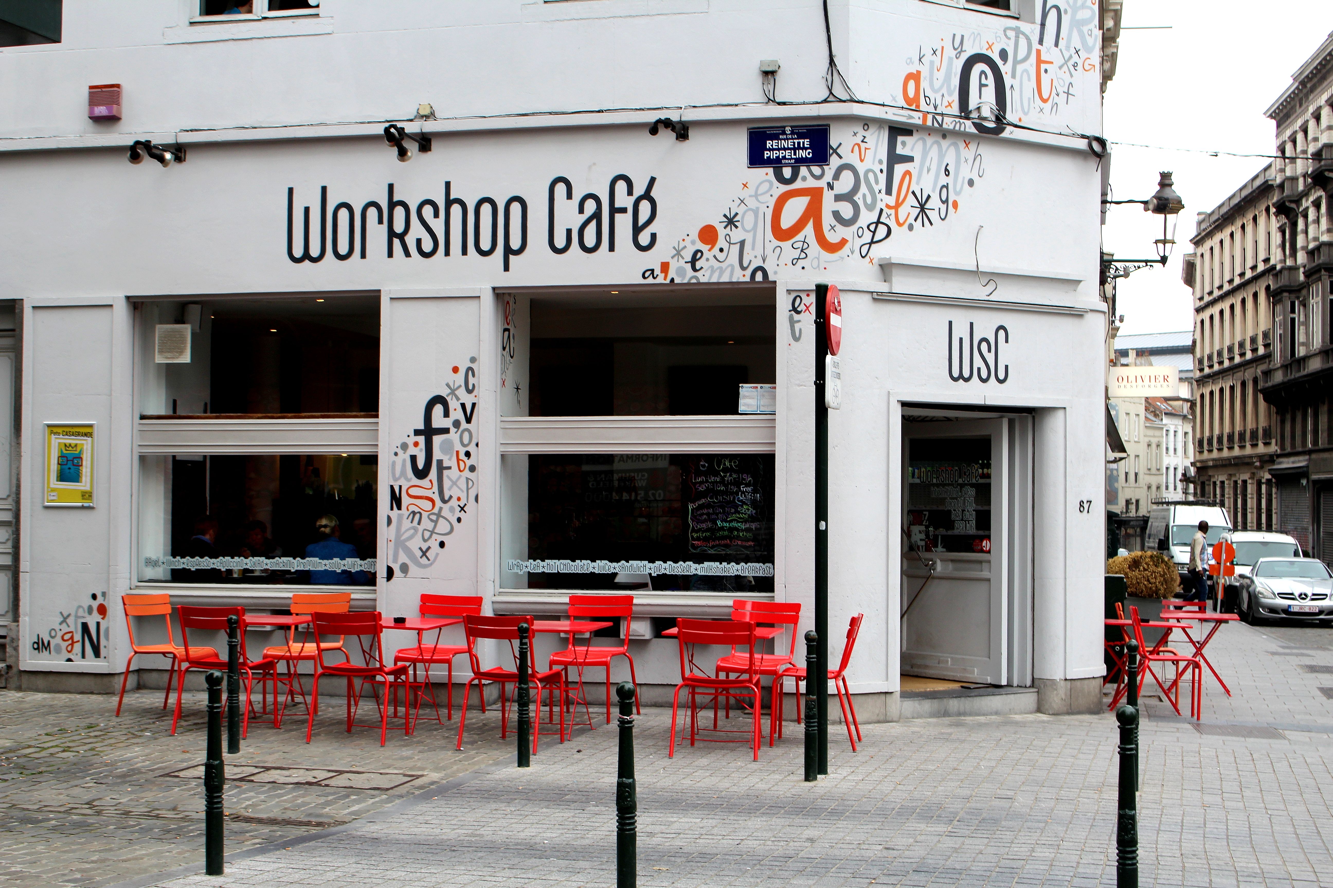 Modern Urban Café in Brussels with Vibrant Seating · Free Stock Photo