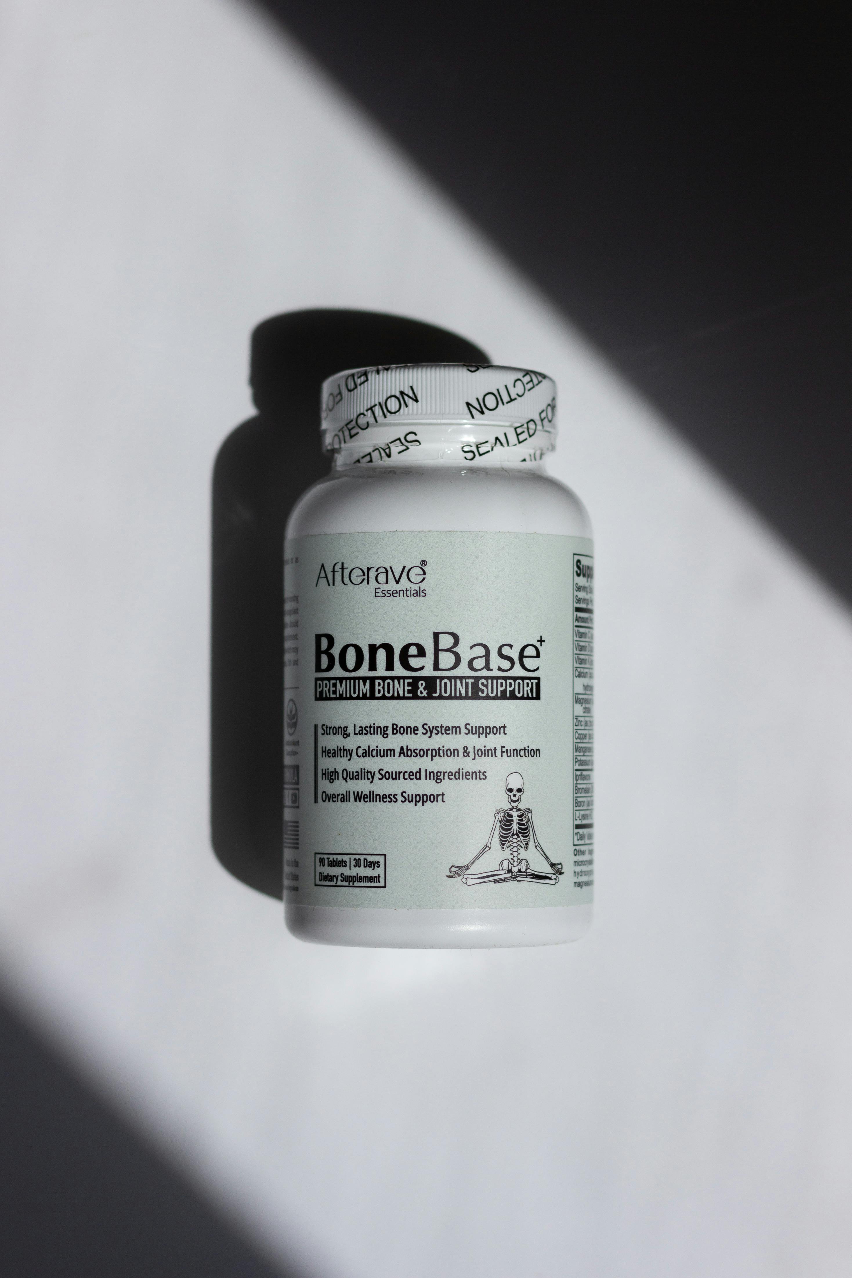 Botella De Suplemento Bone Base Con Sombra Texturizada · Foto de stock gratuita
