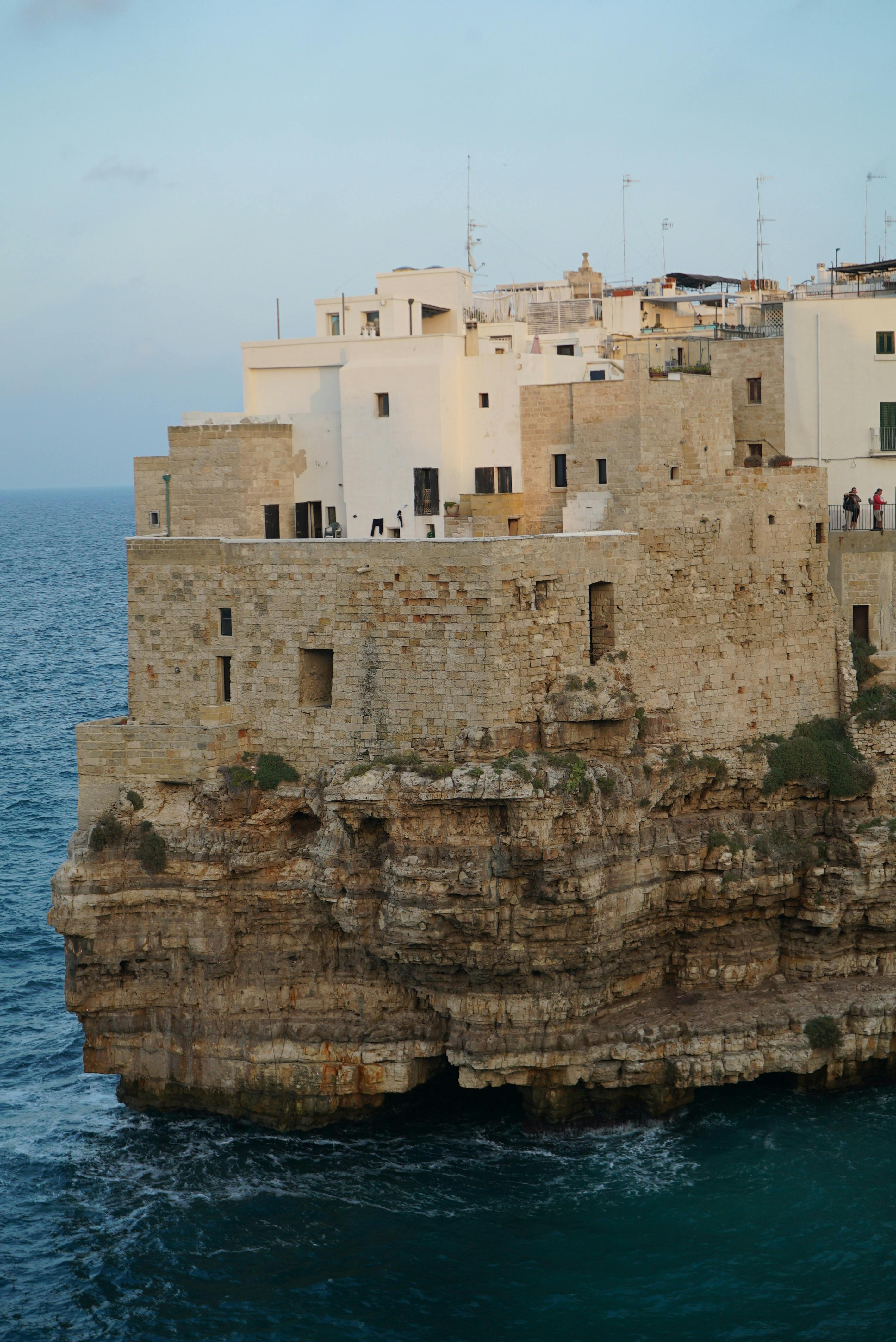Scenic Italian Coastal Cliff Village at Sunset · Free Stock Photo