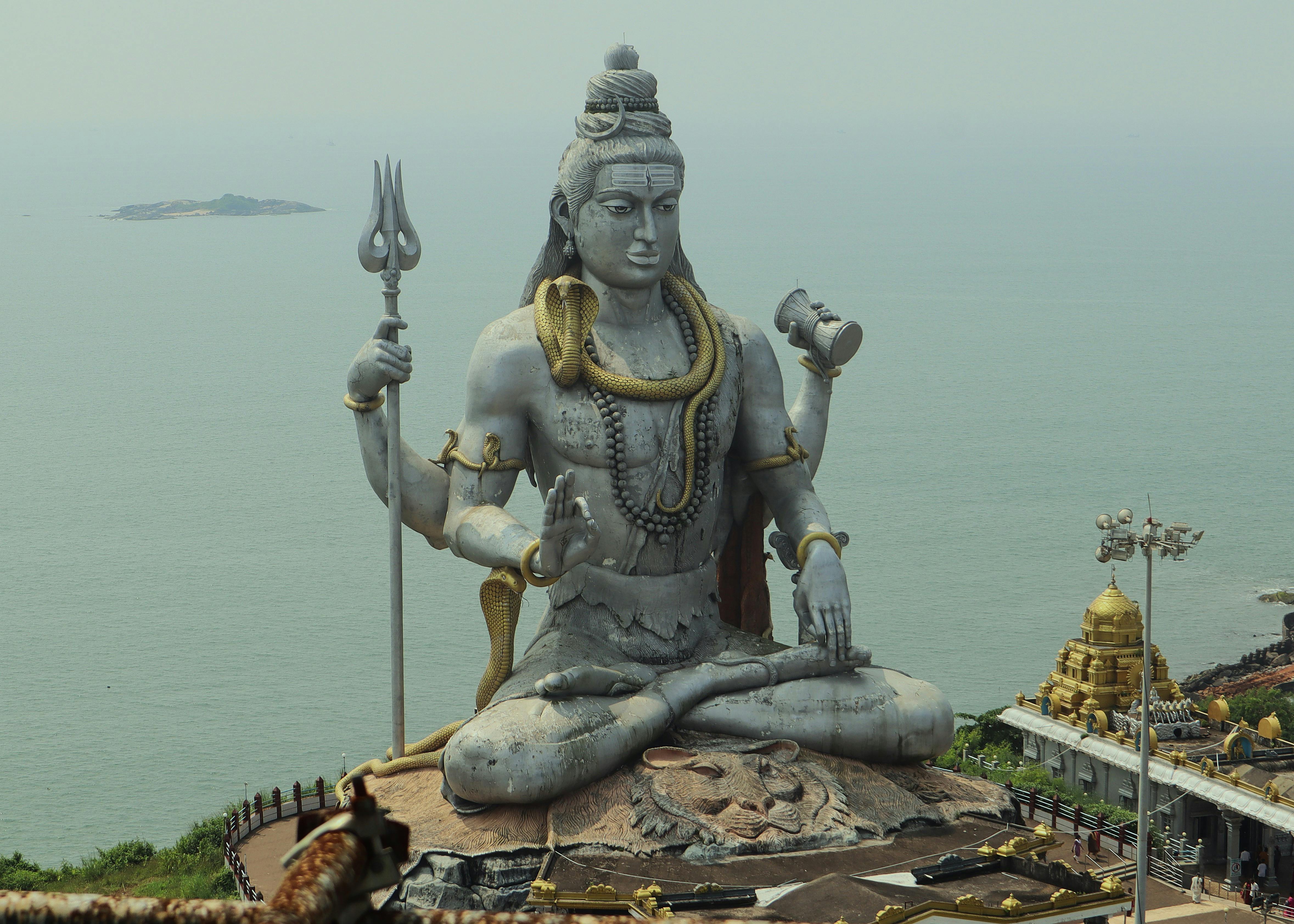 A statue of lord shiva with a trident and a sword · Free Stock Photo