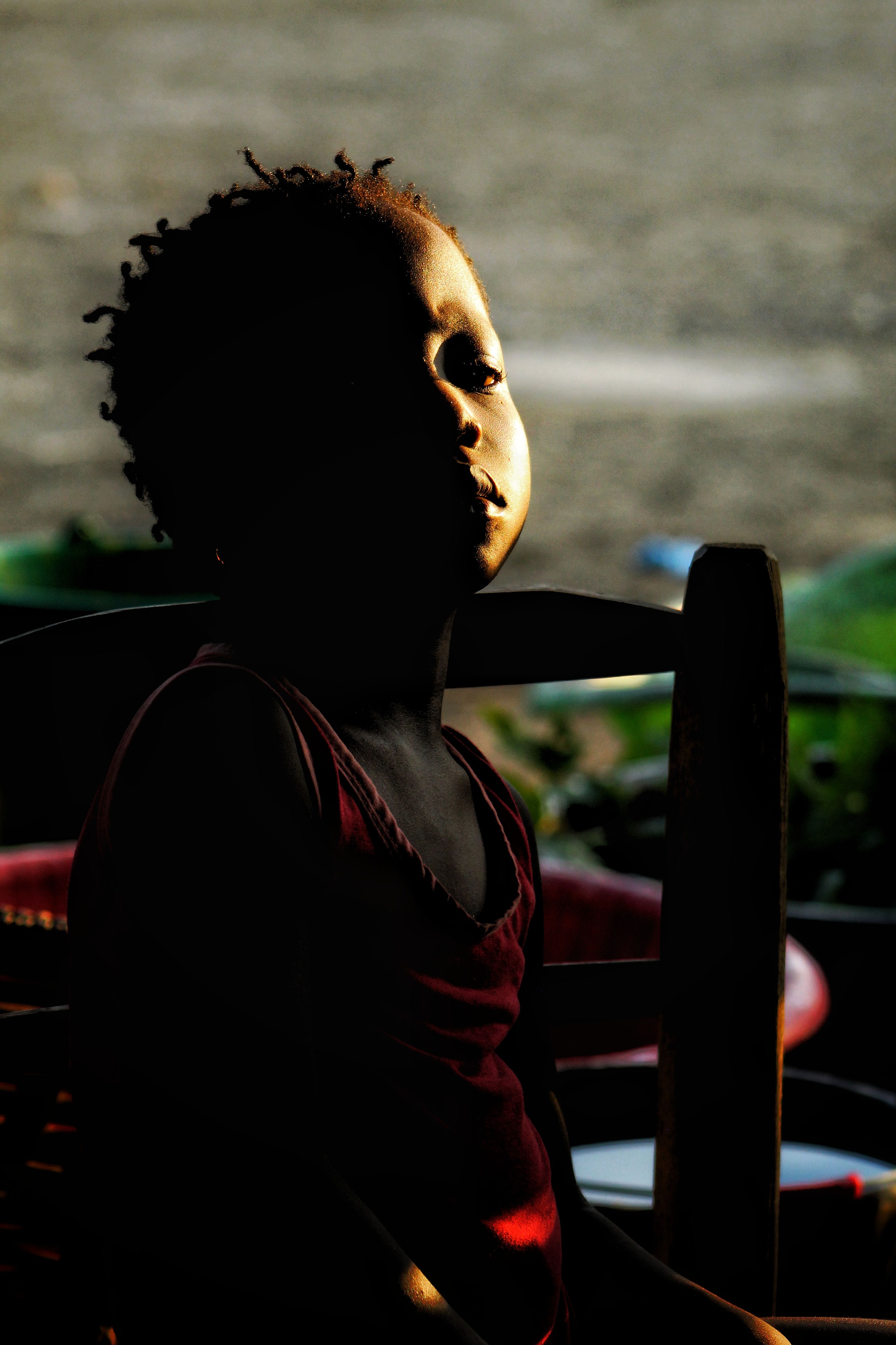 Moody Portrait of a Child in Dim Light · Free Stock Photo