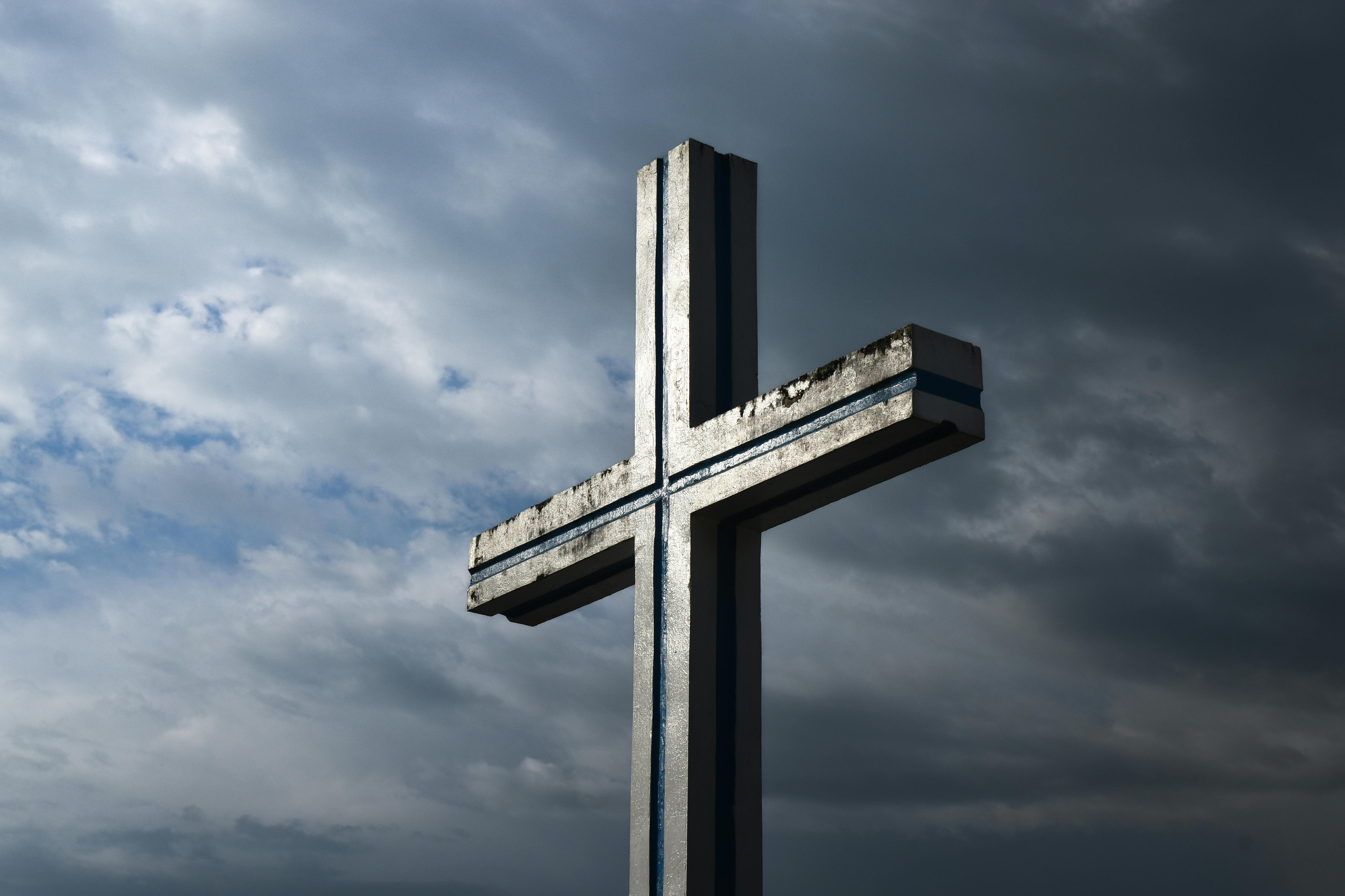 Dramatic Cross Against Cloudy Sky Background · Free Stock Photo