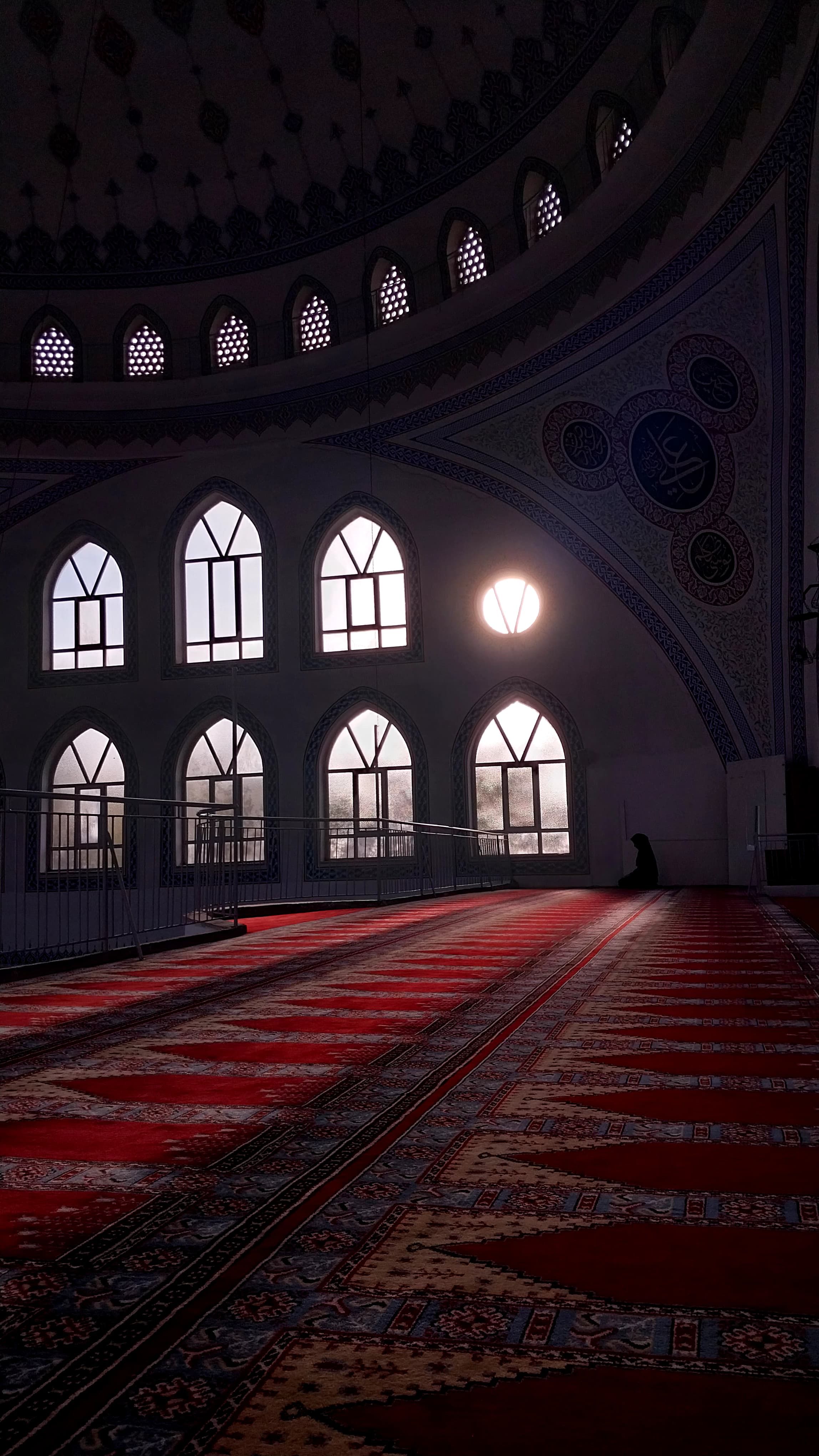 Sunlit Mosque Interior with Arched Windows · Free Stock Photo