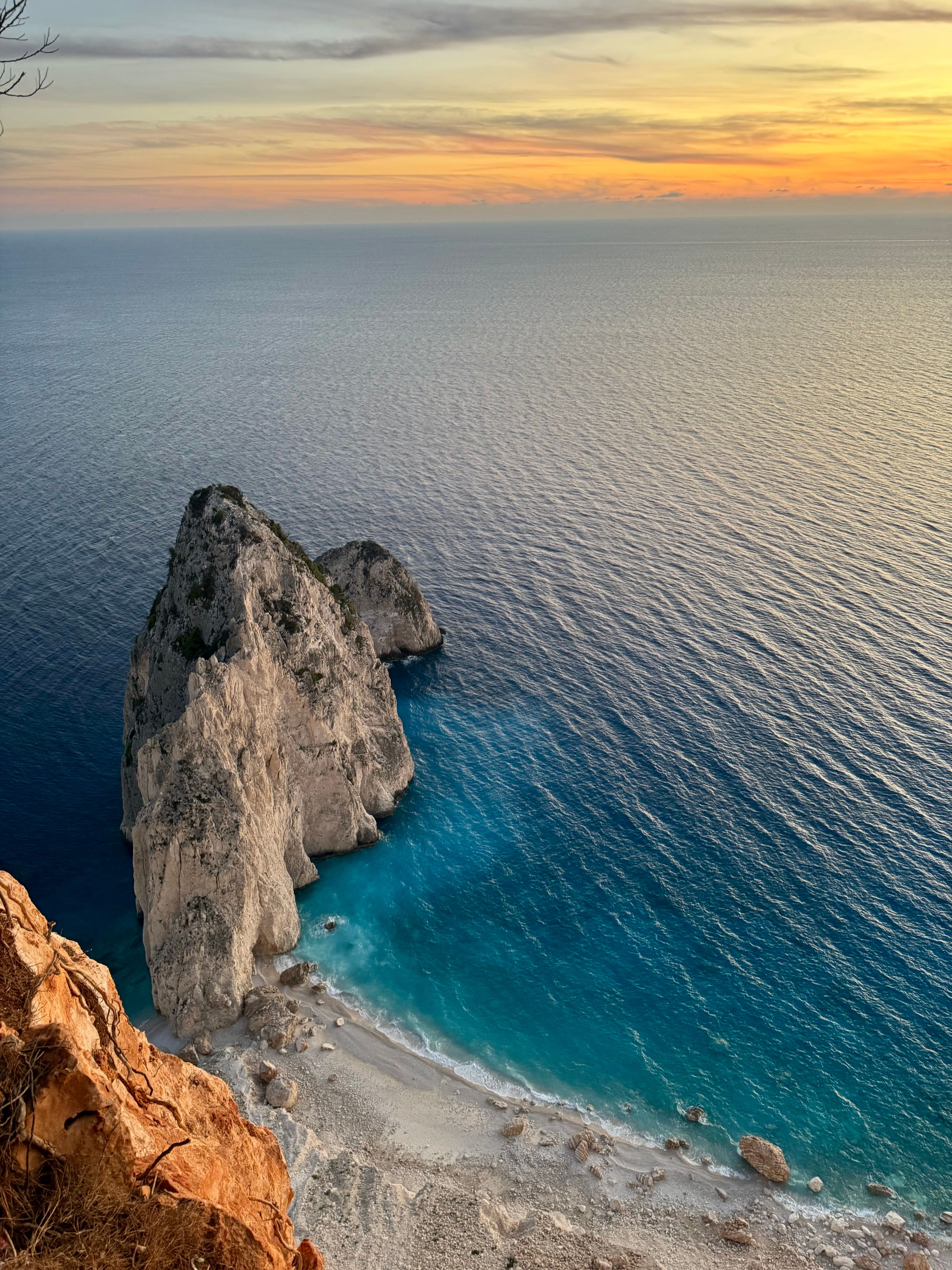 Stunning Sunset Over Greek Cliffside Coast · Free Stock Photo