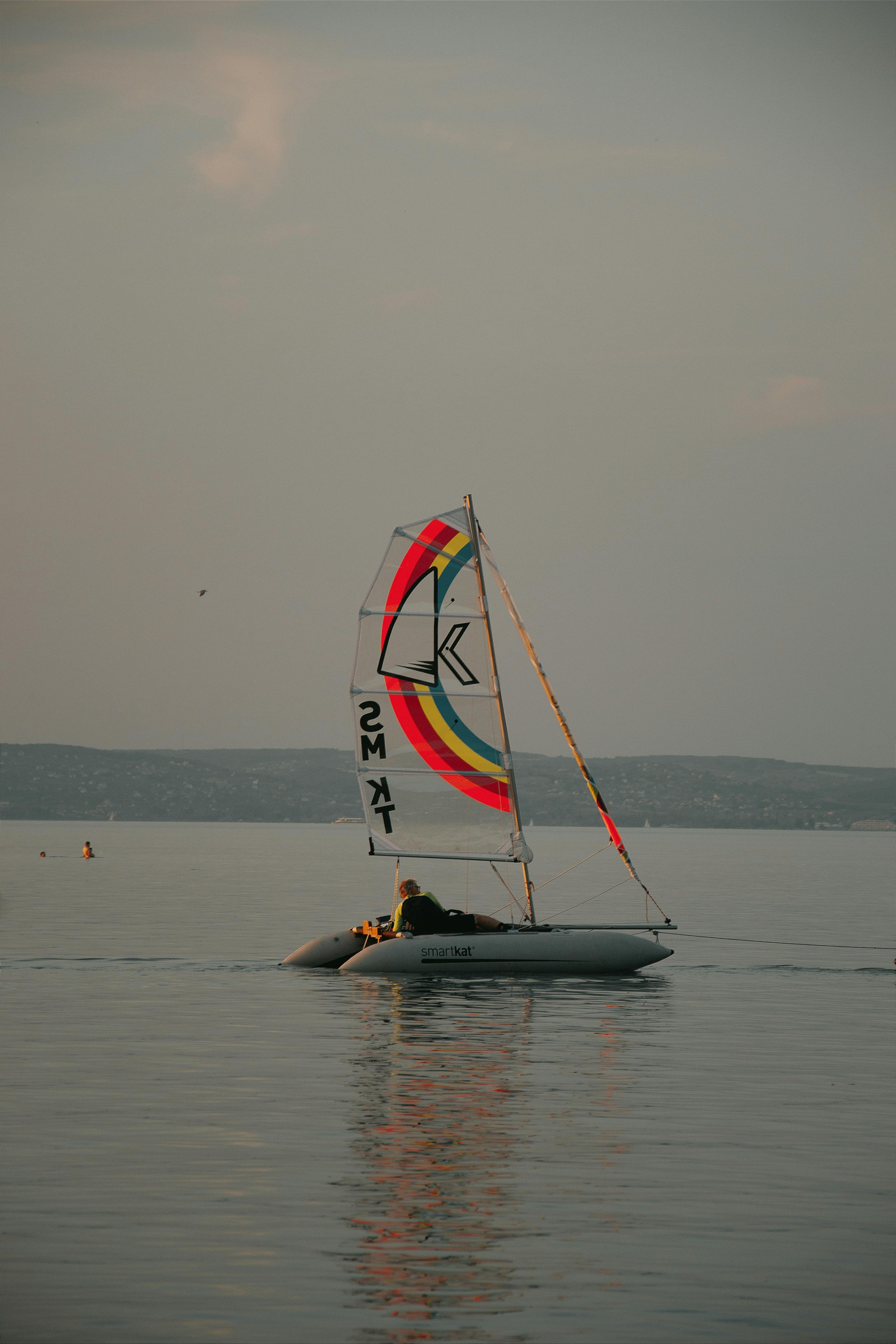 Colorful Sailboat on Lake Balaton at Sunset · Free Stock Photo