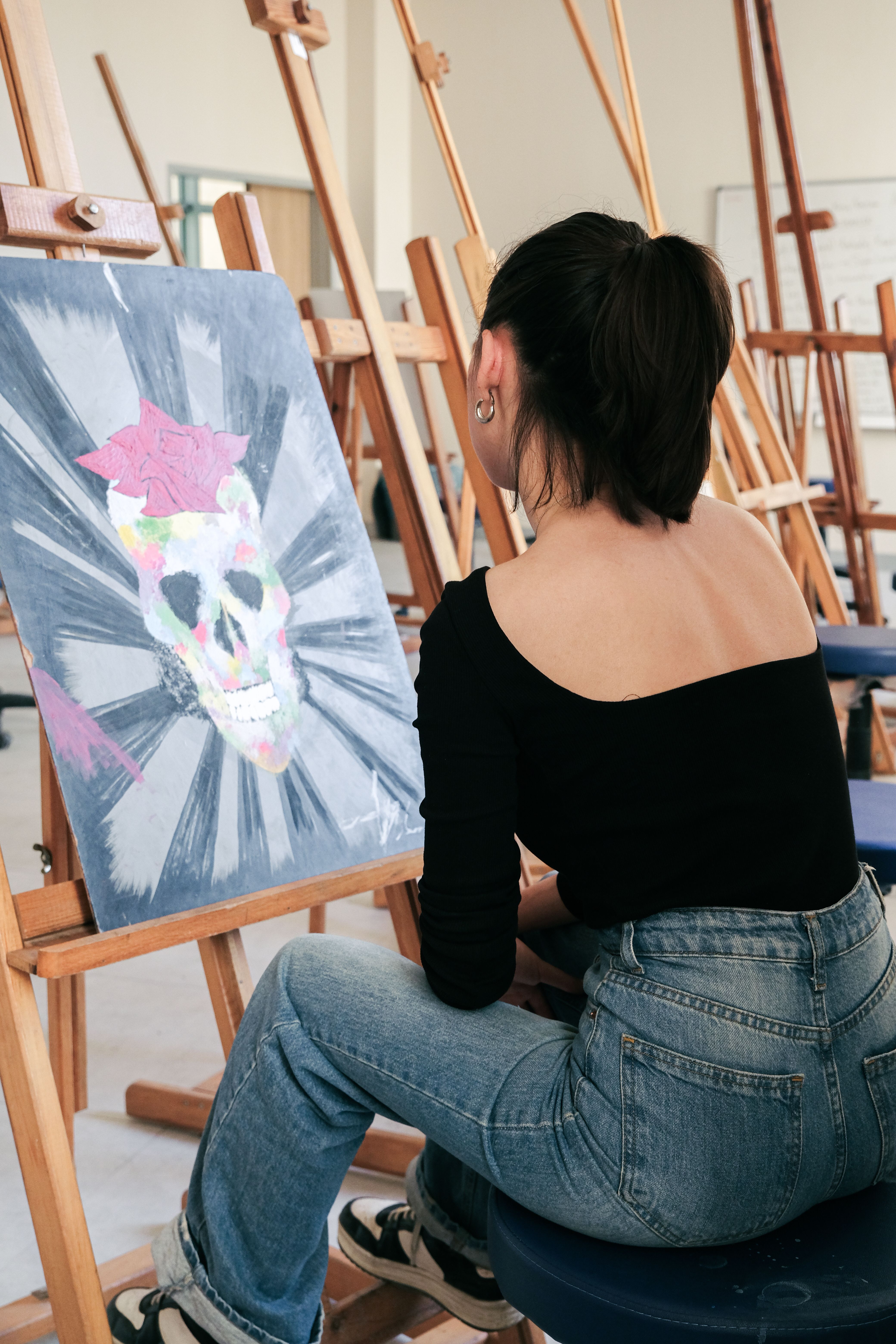Artist Painting Skull Canvas in Studio · Free Stock Photo