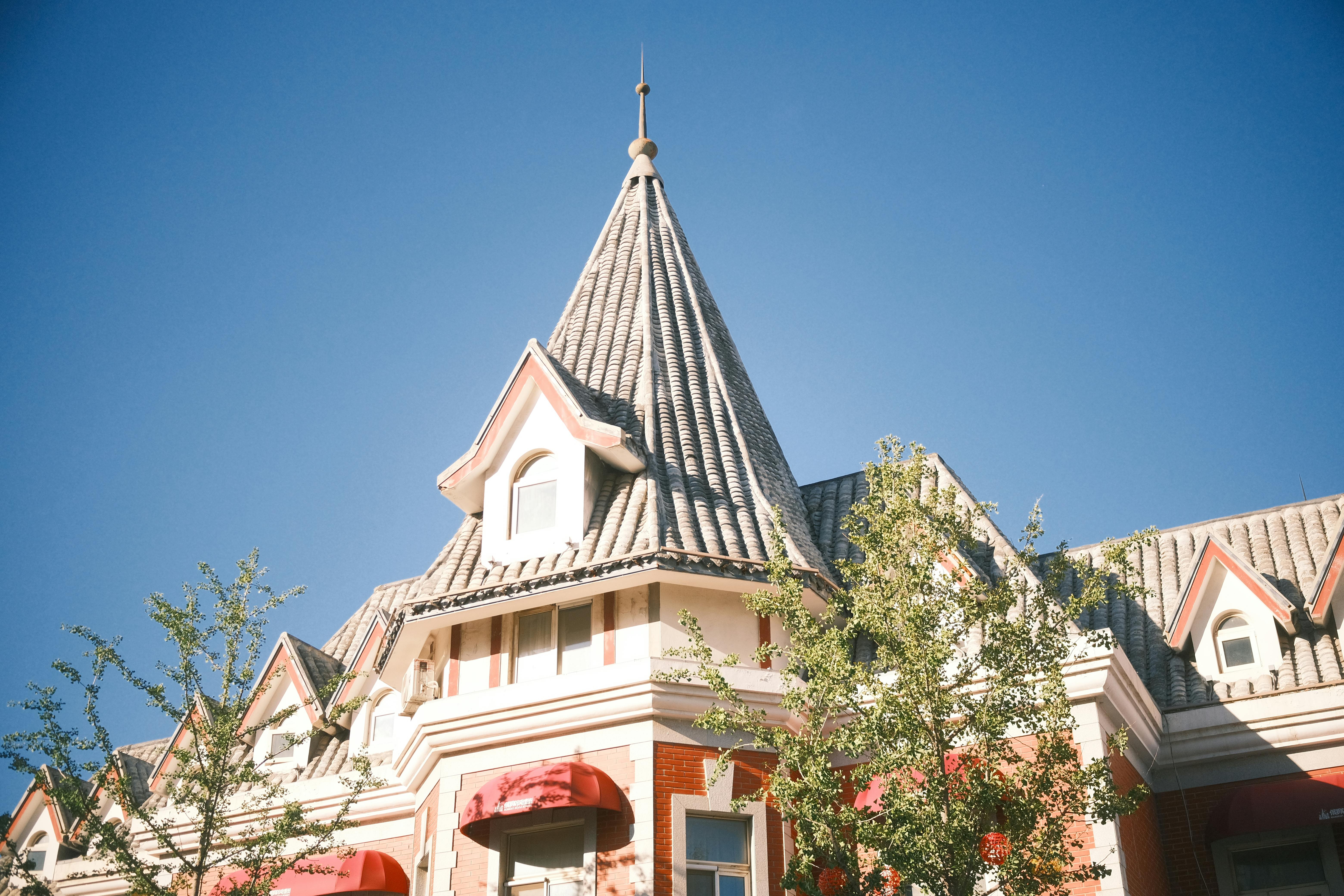 Charming Victorian Roof Against Clear Blue Sky · Free Stock Photo