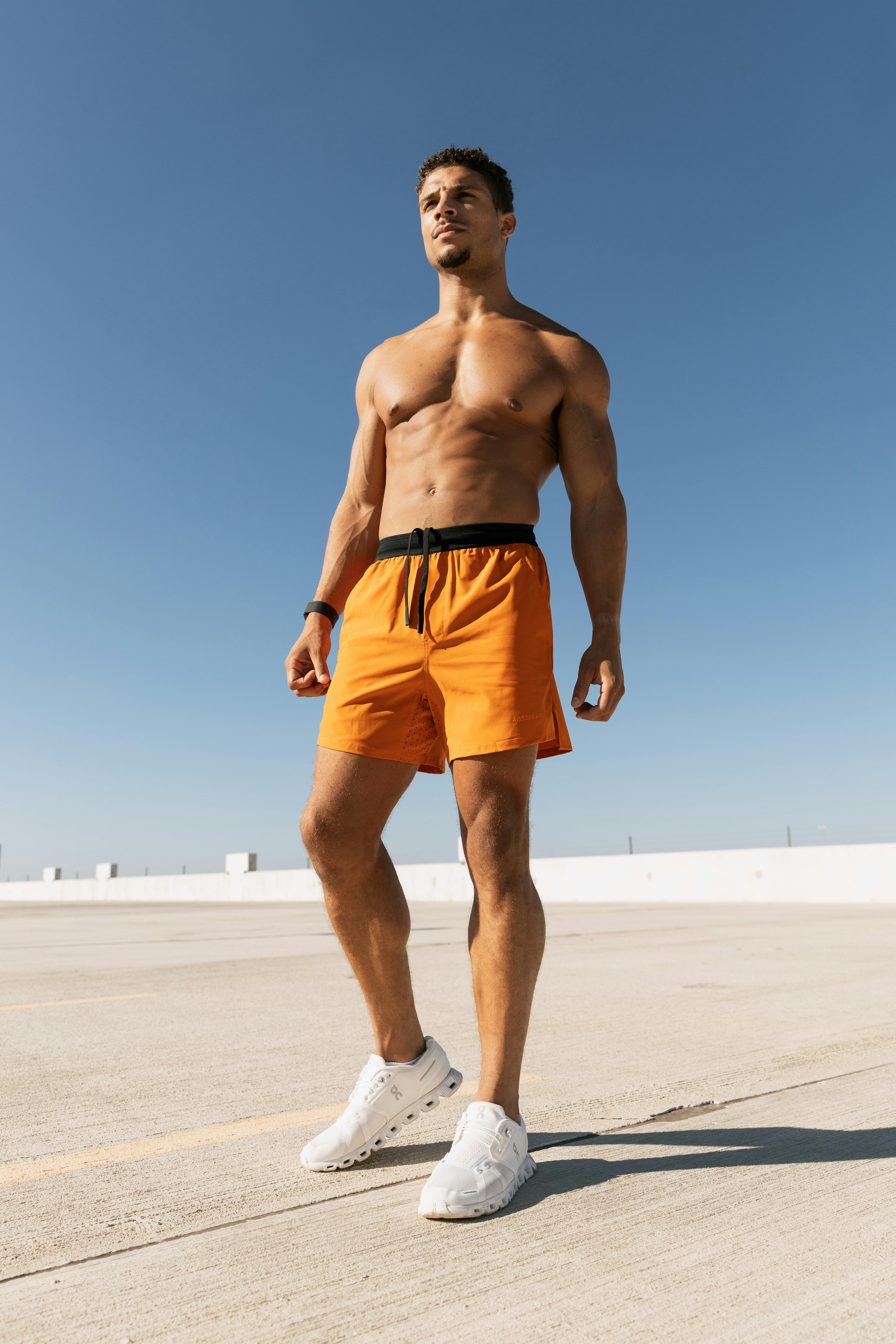 Athletic Man Modeling on Roof in Austin · Free Stock Photo