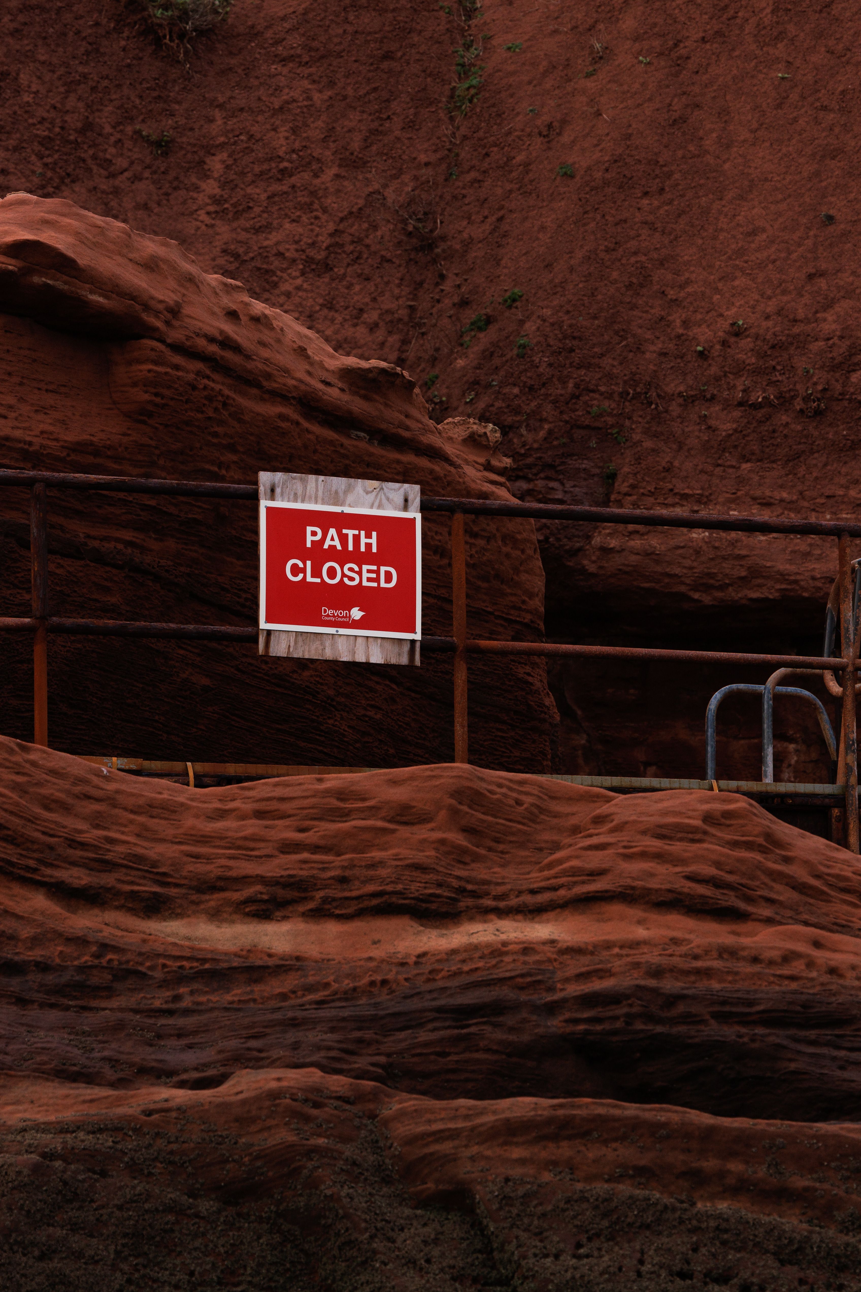 Red Rock Pathway with Closed Sign in Scenic Canyon · Free Stock Photo