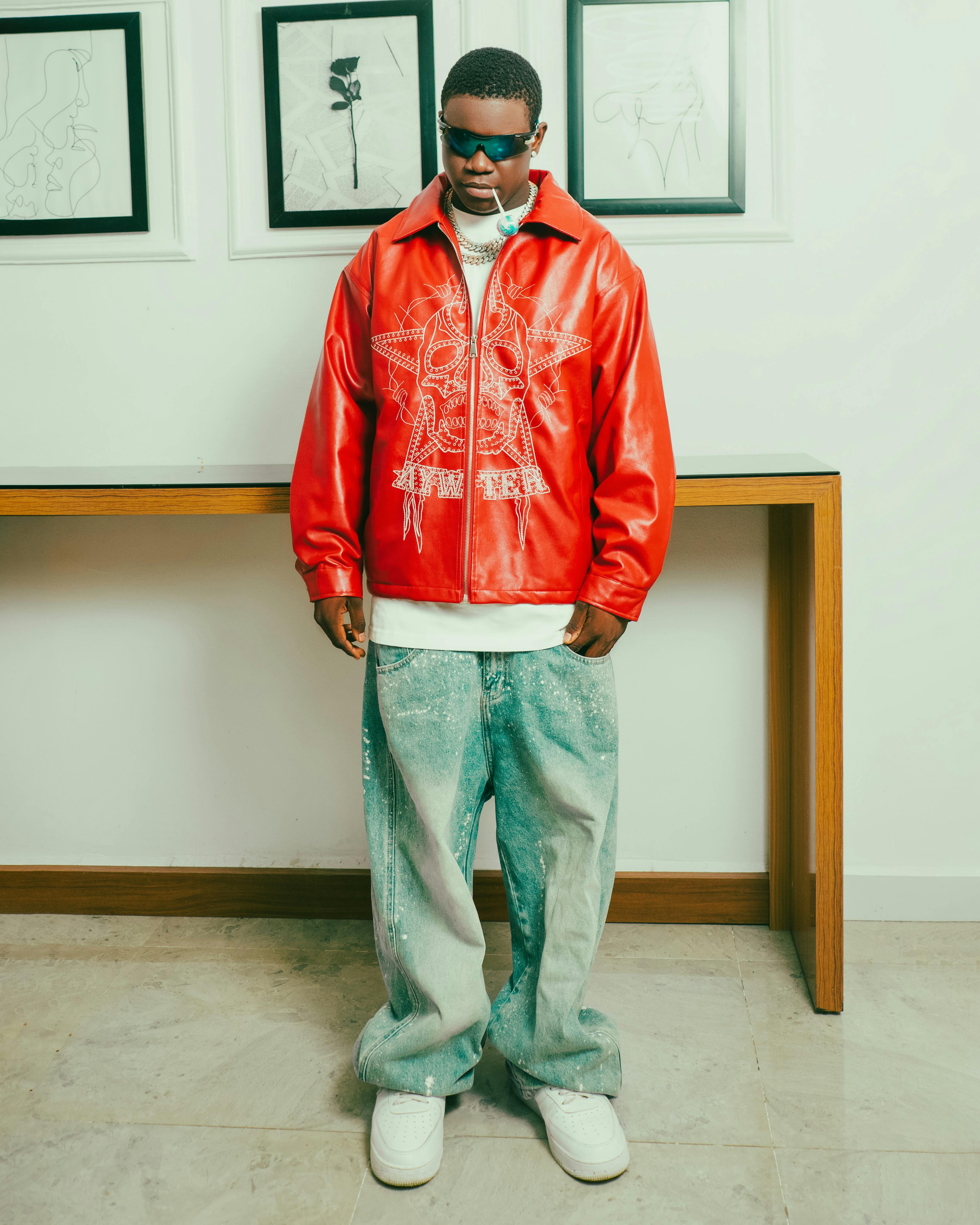 Fashionable Urban Style with Red Jacket Indoors · Free Stock Photo