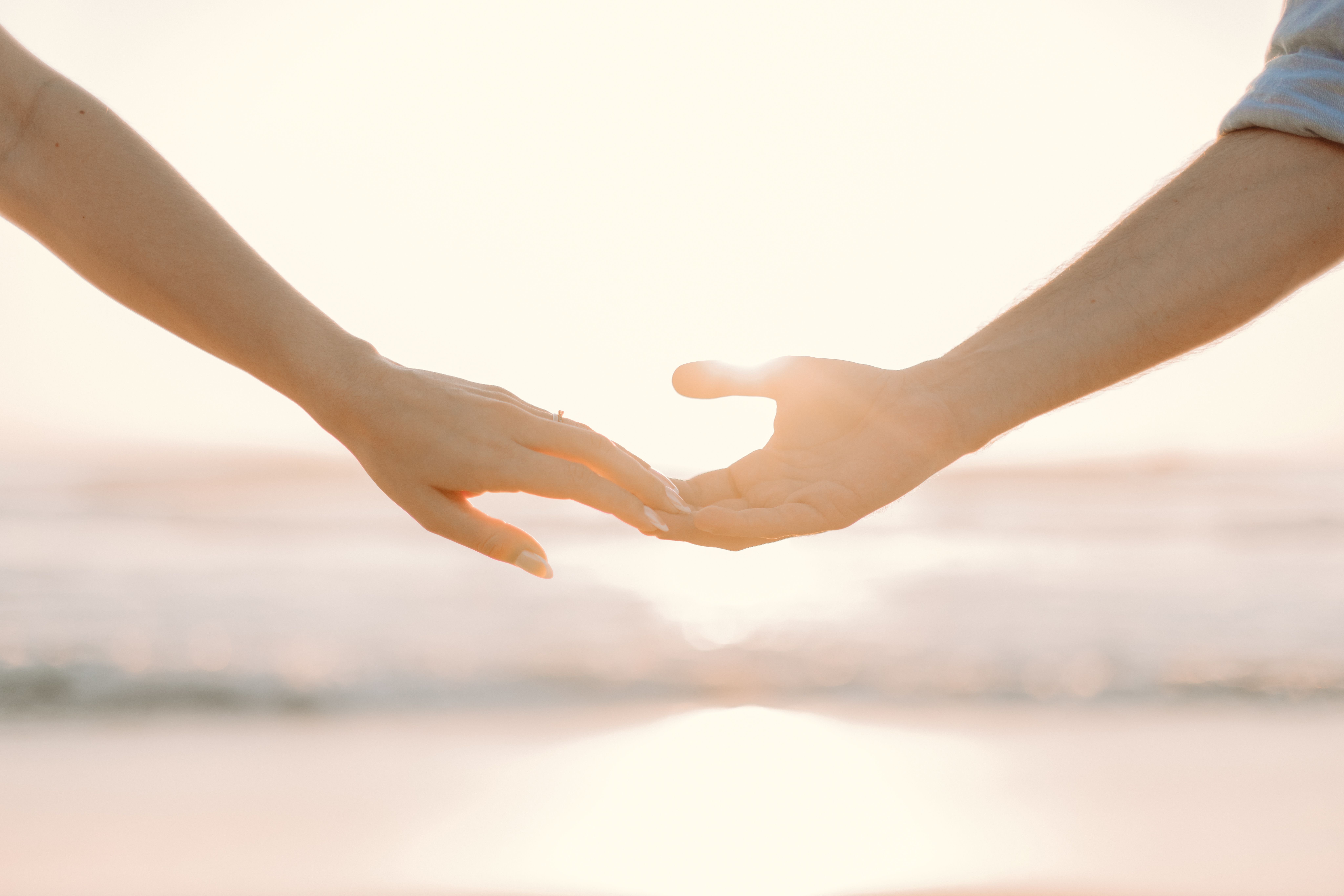 Gentle Hands Reaching Towards Sunset Horizon · Free Stock Photo