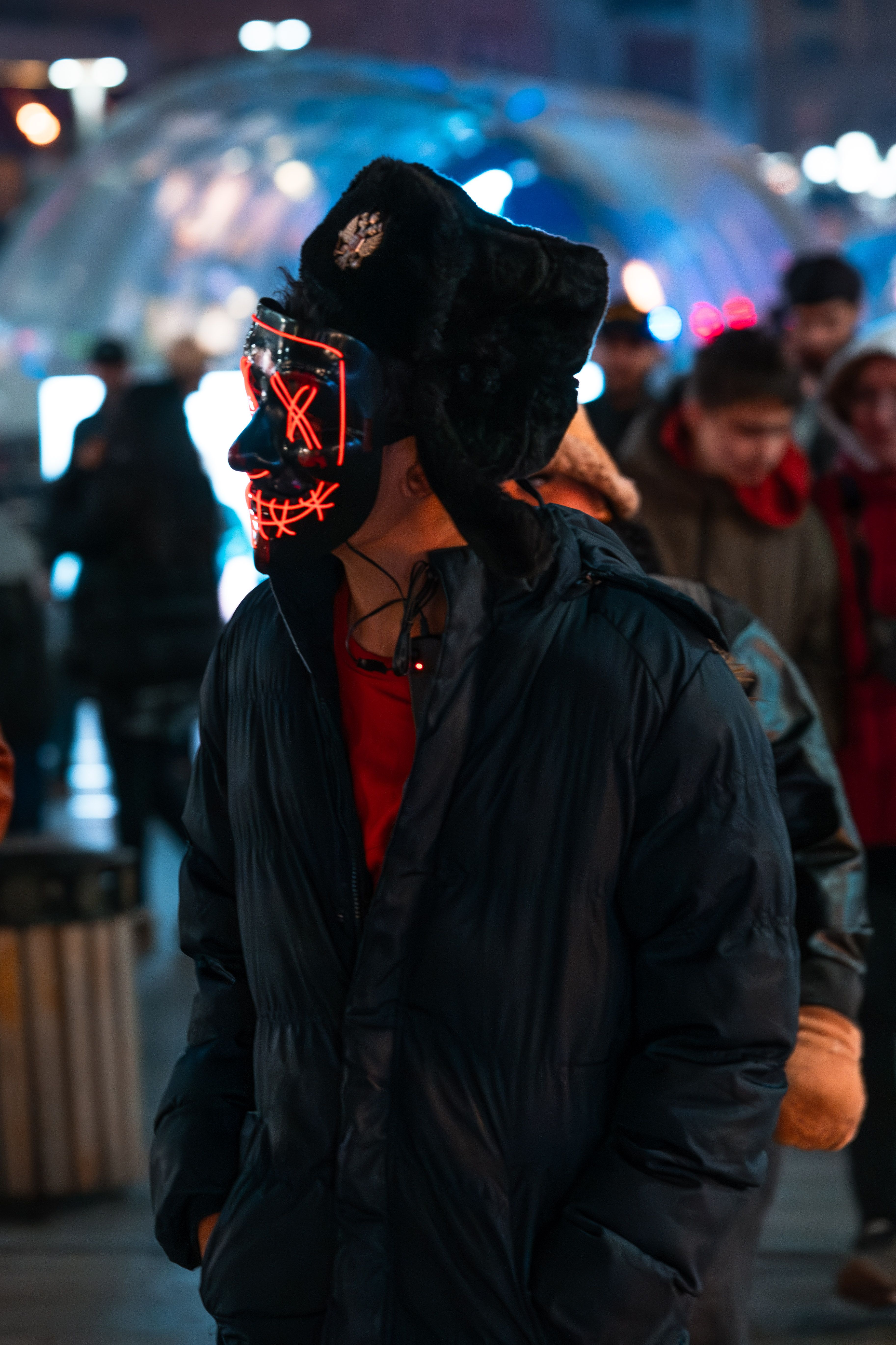 Mystery Person in Neon Mask at Night Gathering · Free Stock Photo
