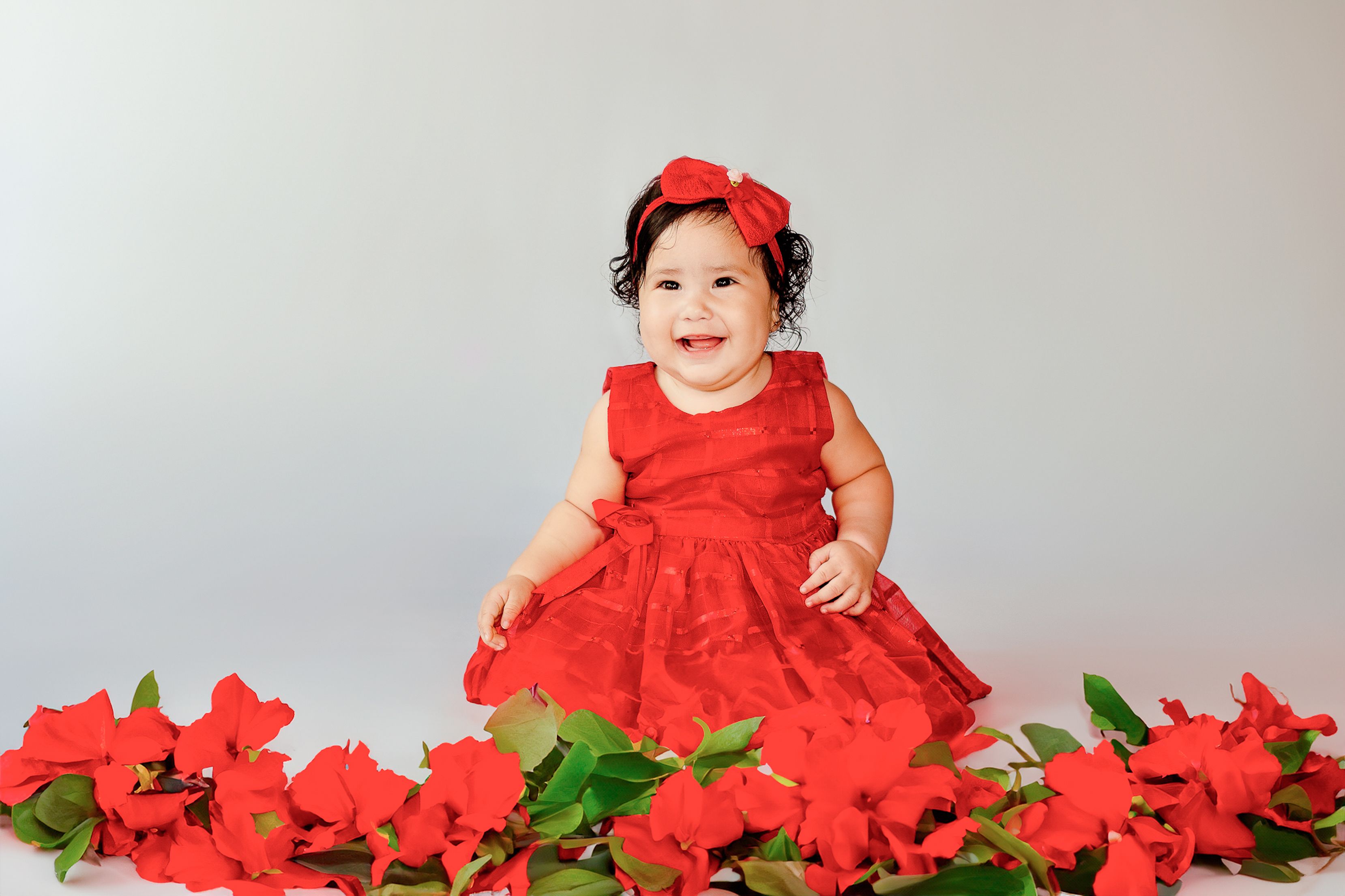 Adorable Smiling Baby in Red Dress with Flowers · Free Stock Photo
