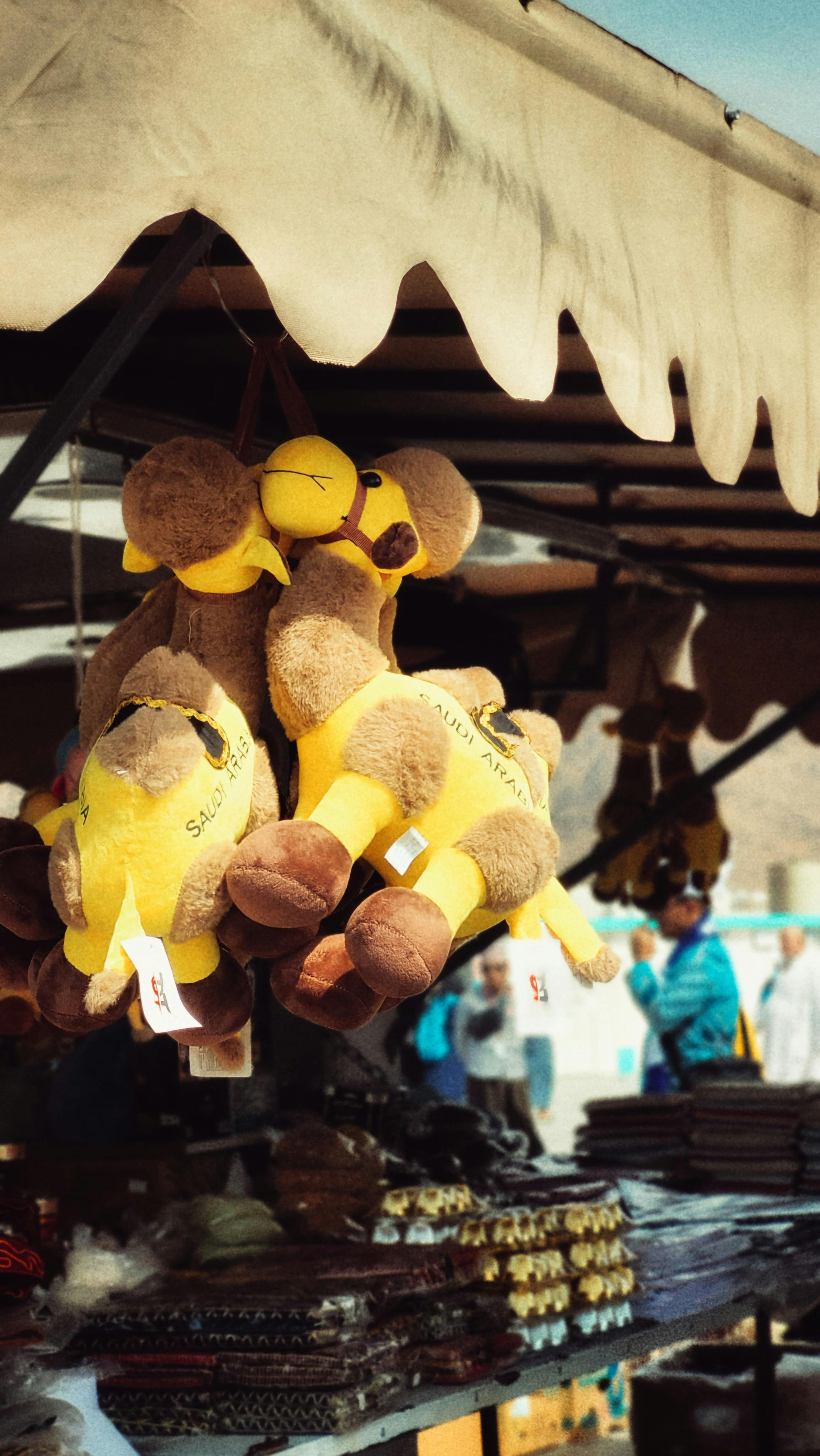 Street Market Stall with Hanging Plush Toys · Free Stock Photo
