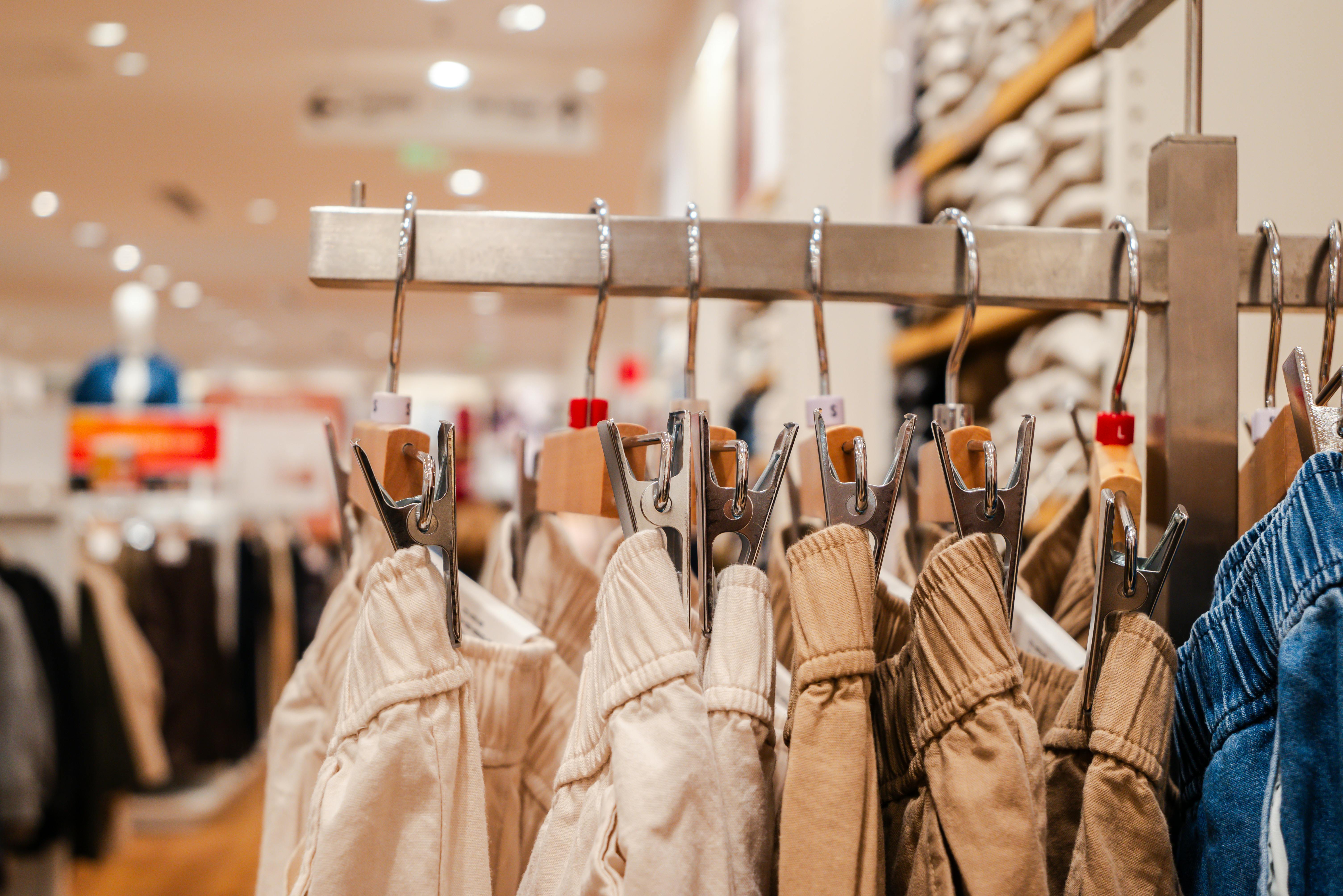 Close-up of clothing rack in a retail store · Free Stock Photo