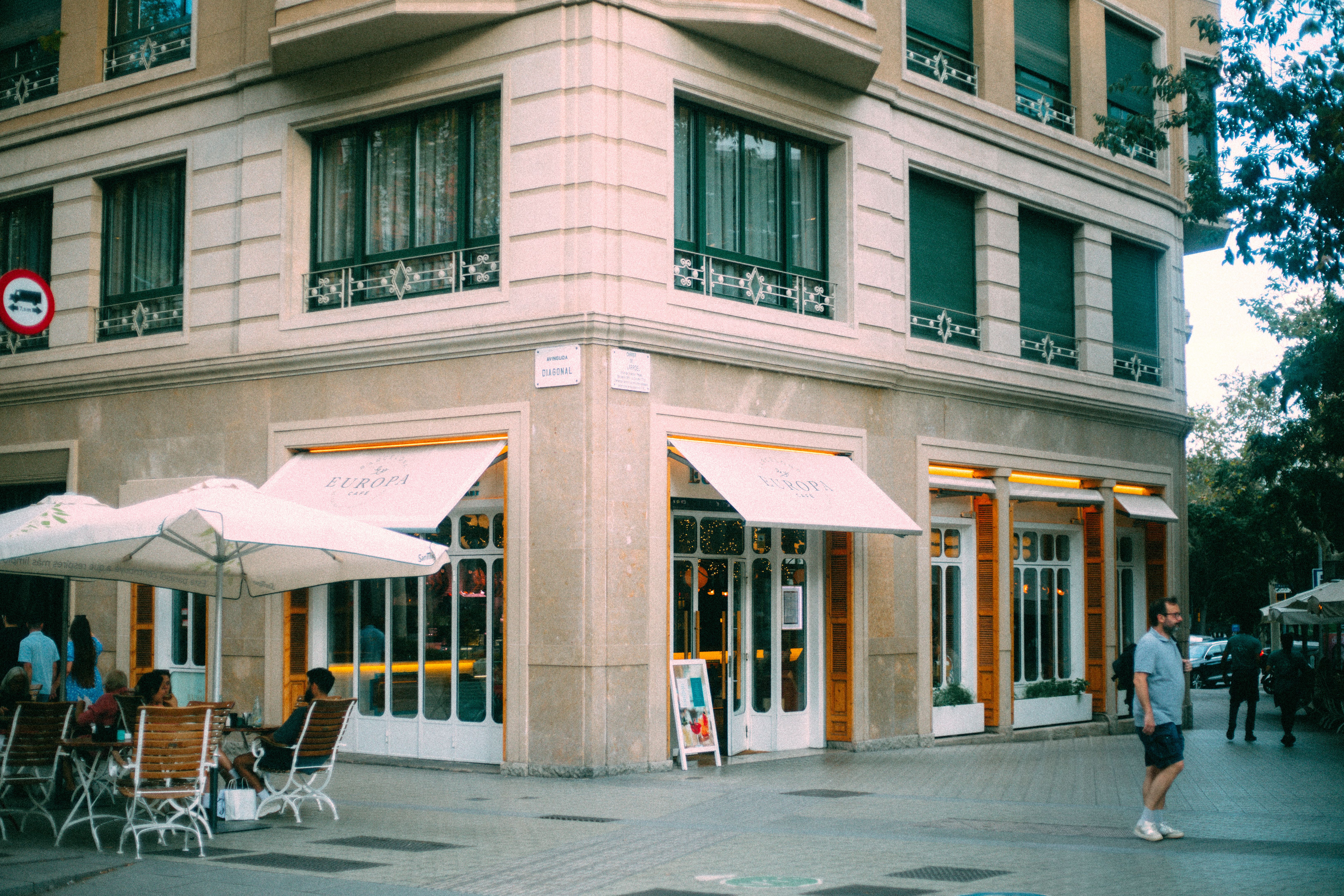 Charming European Café on Busy Street Corner · Free Stock Photo