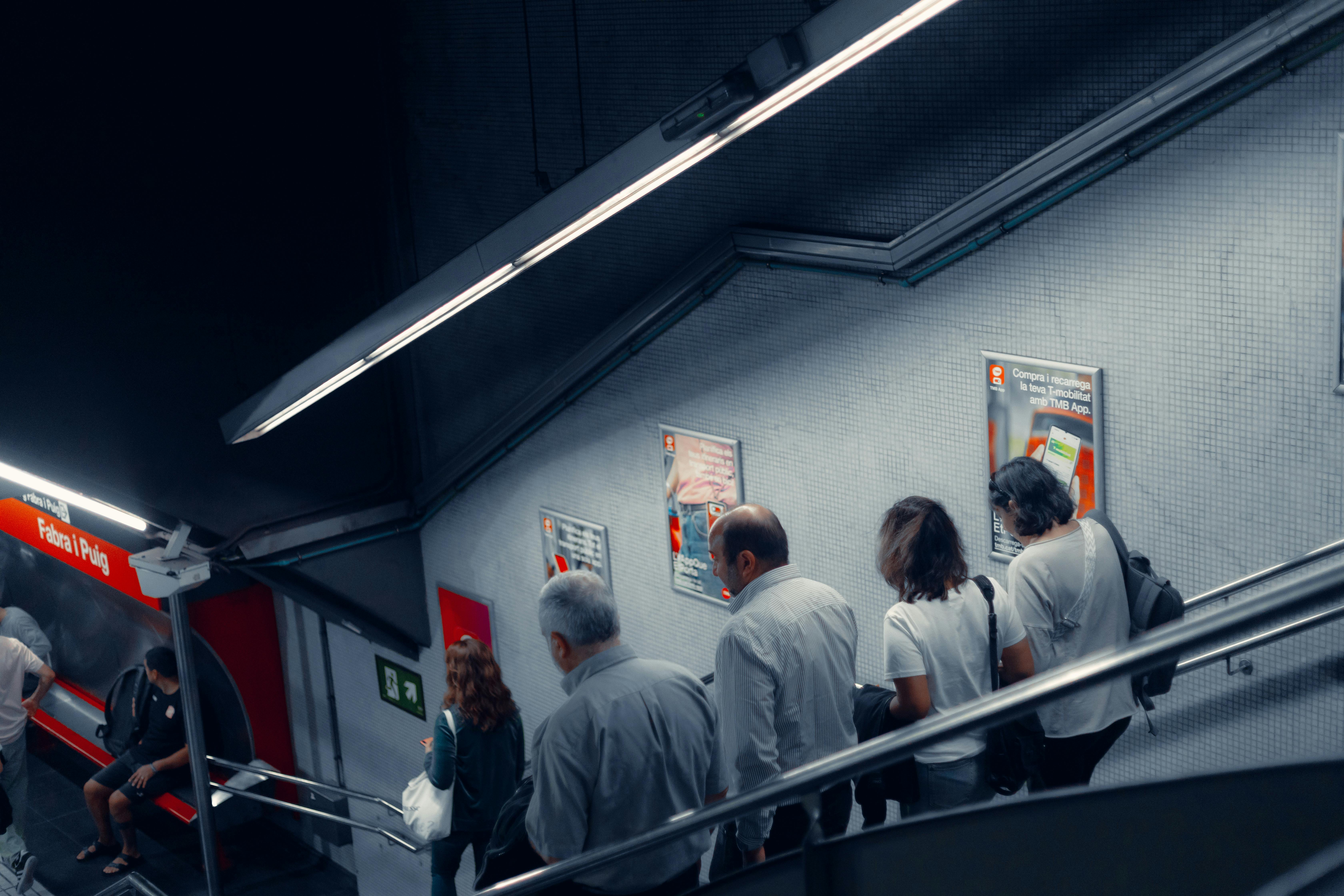 Urban Subway Commuters Descending Stairs Scene · Free Stock Photo