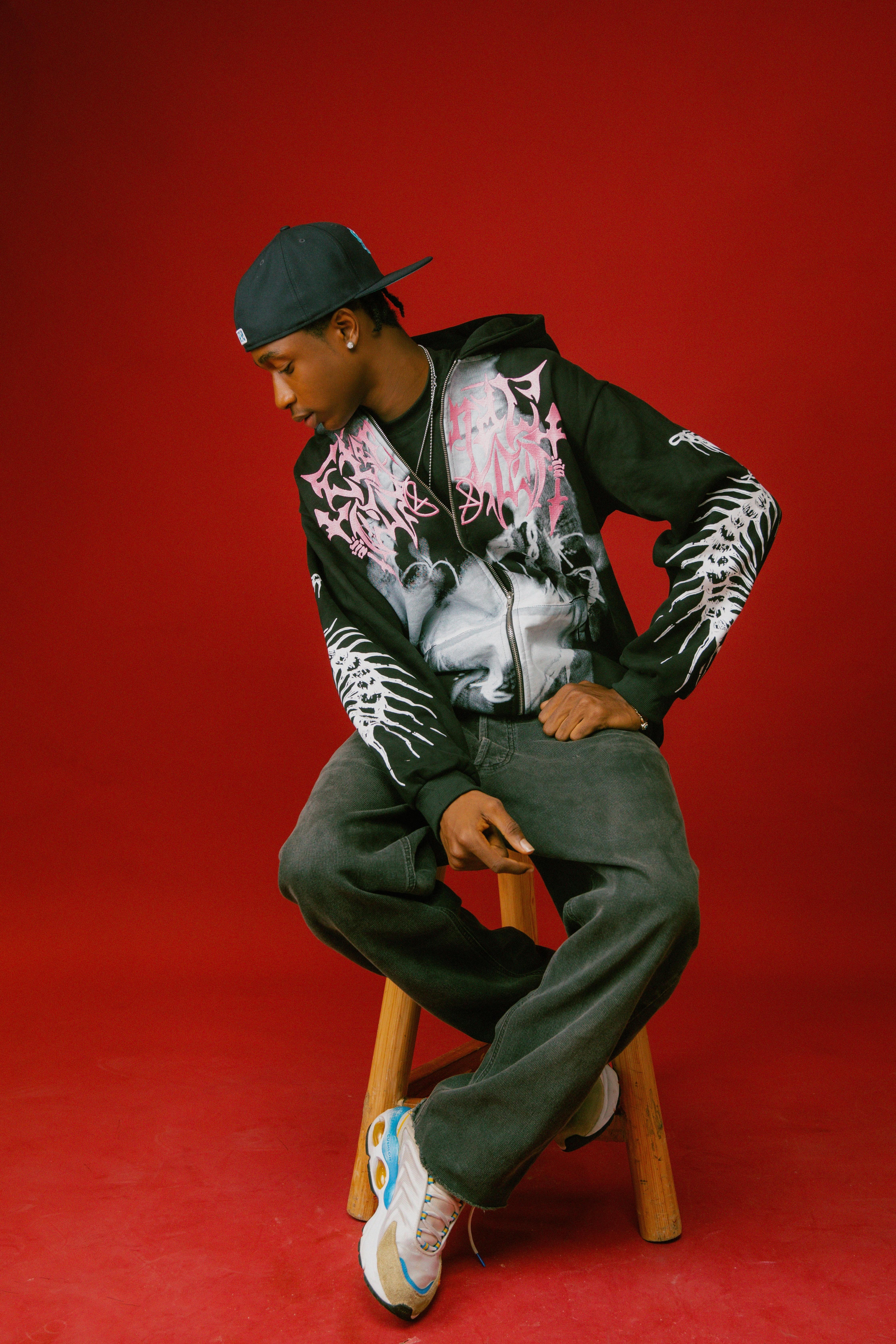 Casual Streetwear Fashion Portrait on Red Background · Free Stock Photo