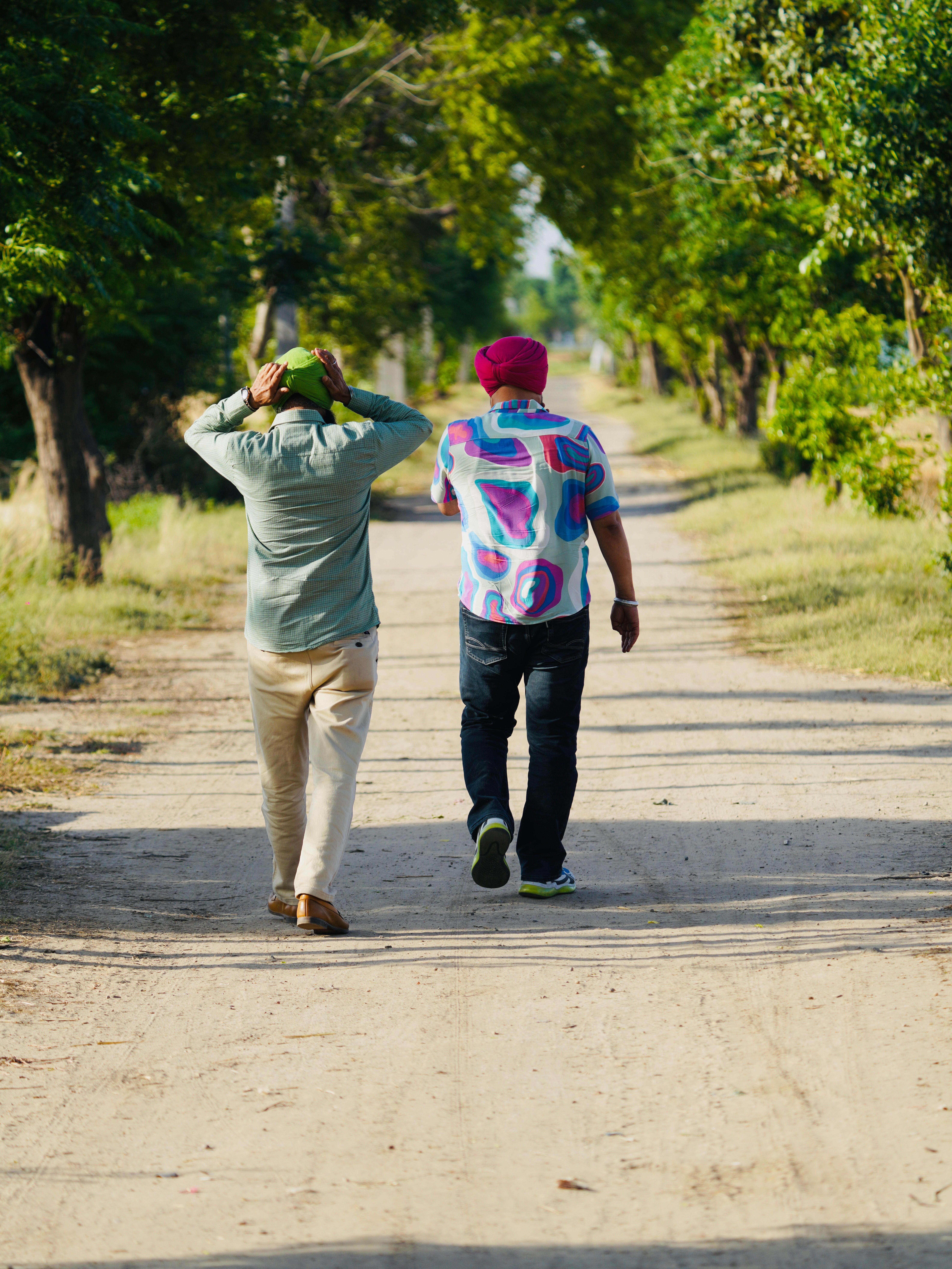 Two Men Walking on Rural Pathway in Summer · Free Stock Photo