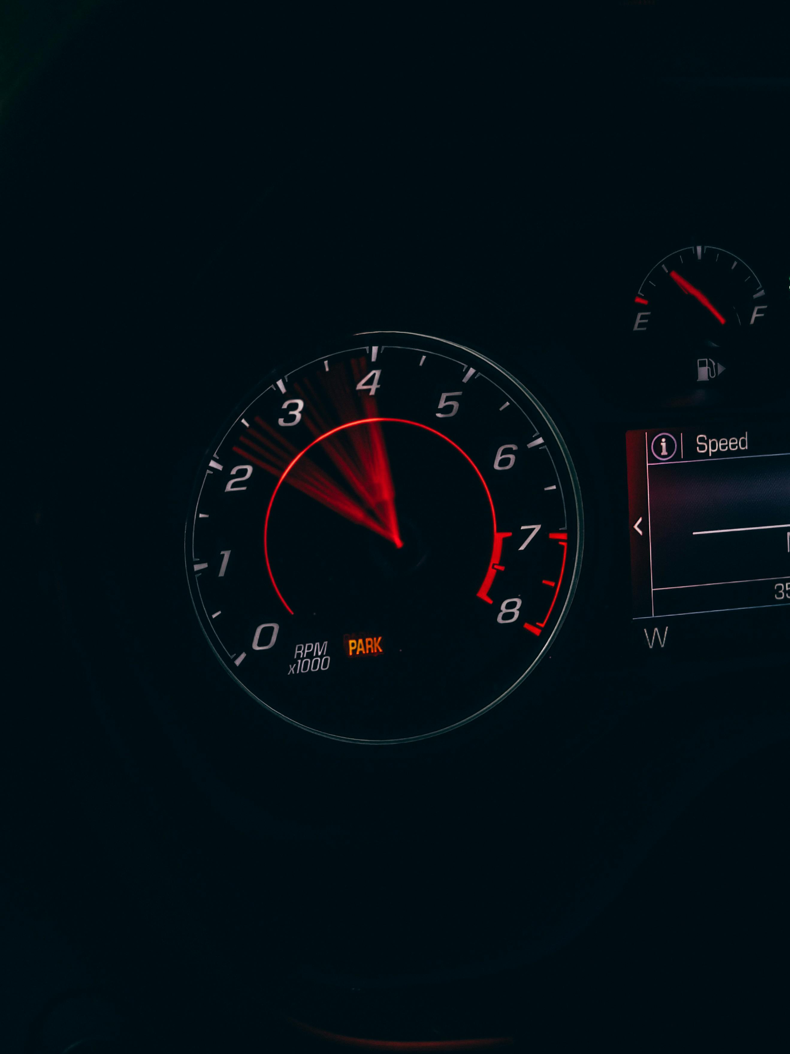 Close-Up of Car Tachometer with Red Needle · Free Stock Photo