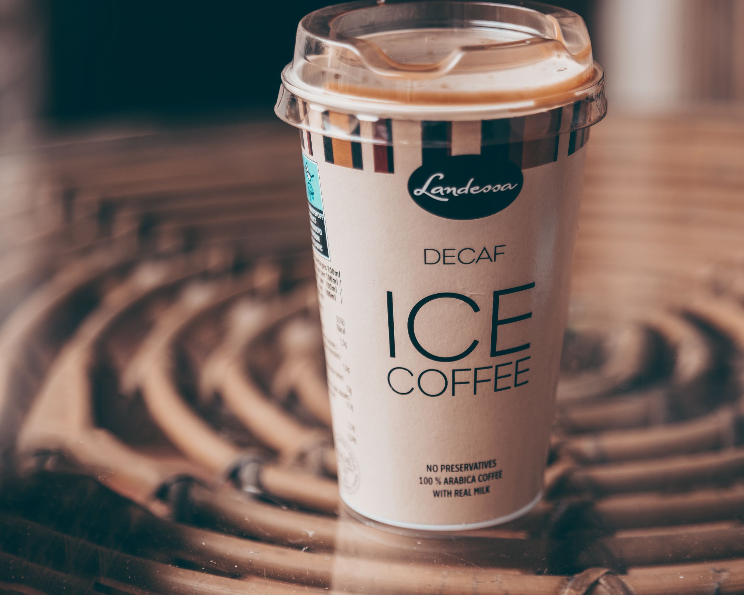 Stylish Decaf Iced Coffee Cup on Table · Free Stock Photo